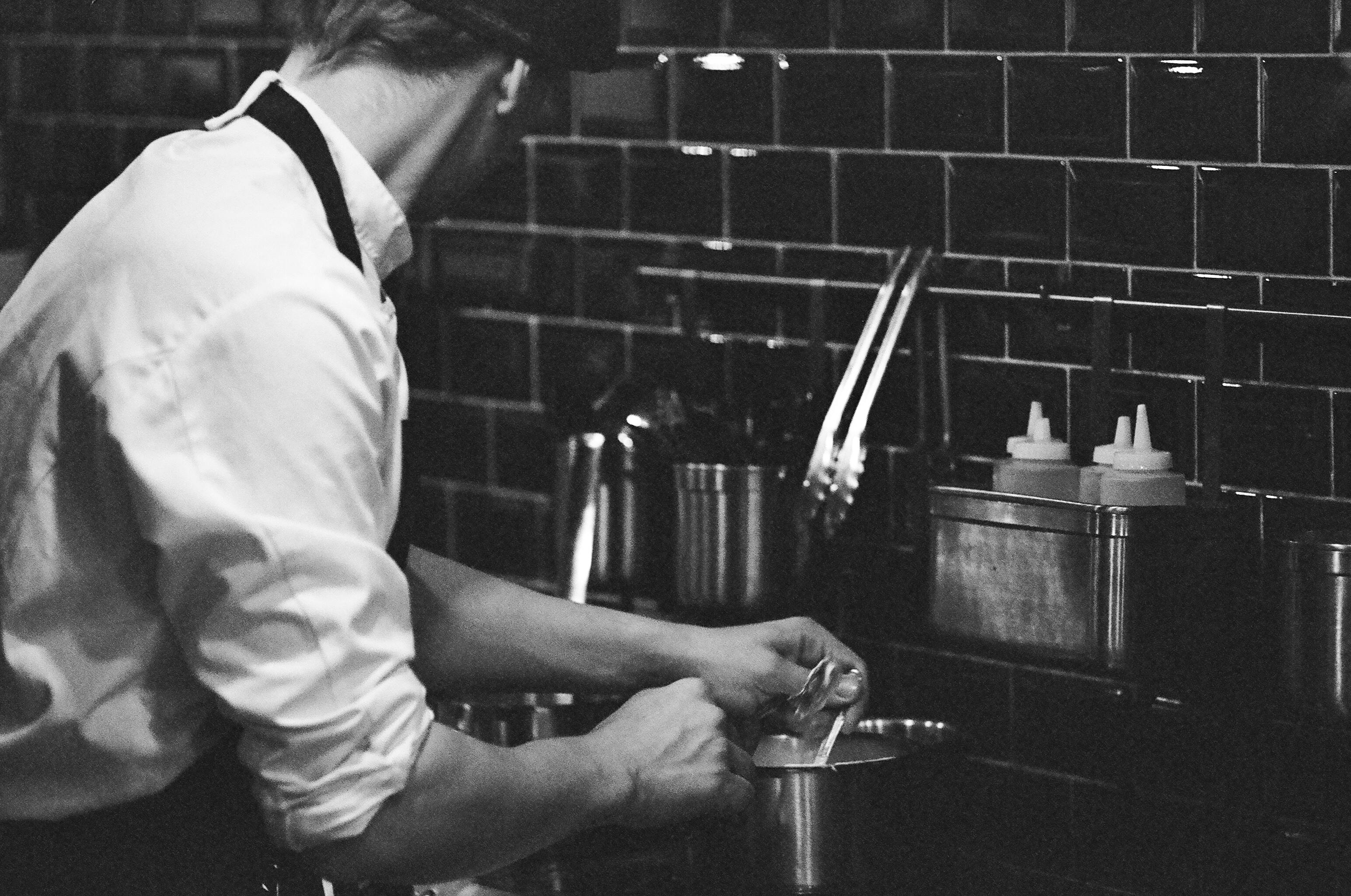 Man in Shirt Working in Kitchen · Free Stock Photo