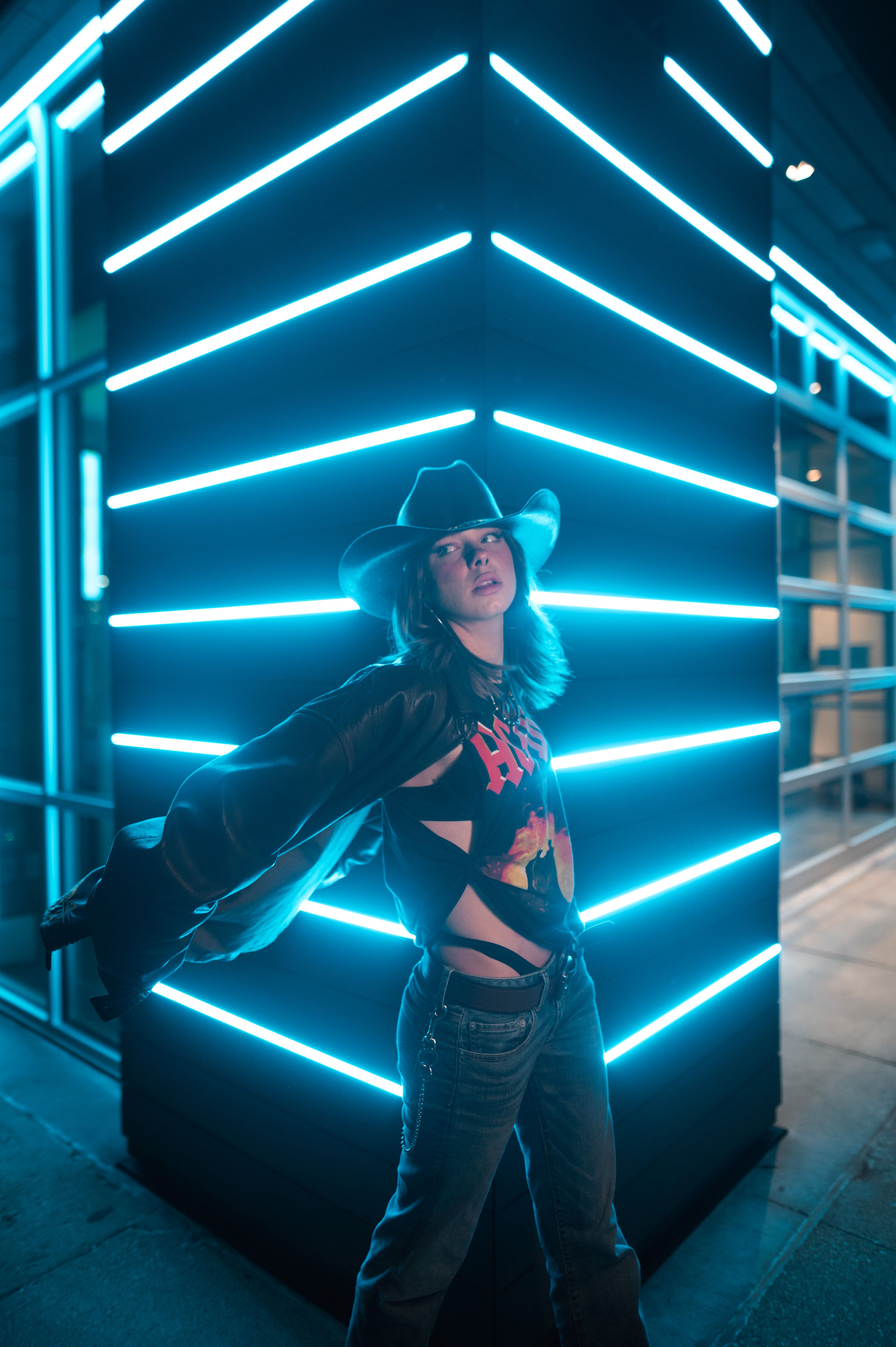 A Young Woman in a Black Leather Jacket and Cowboy Hat · Free Stock Photo