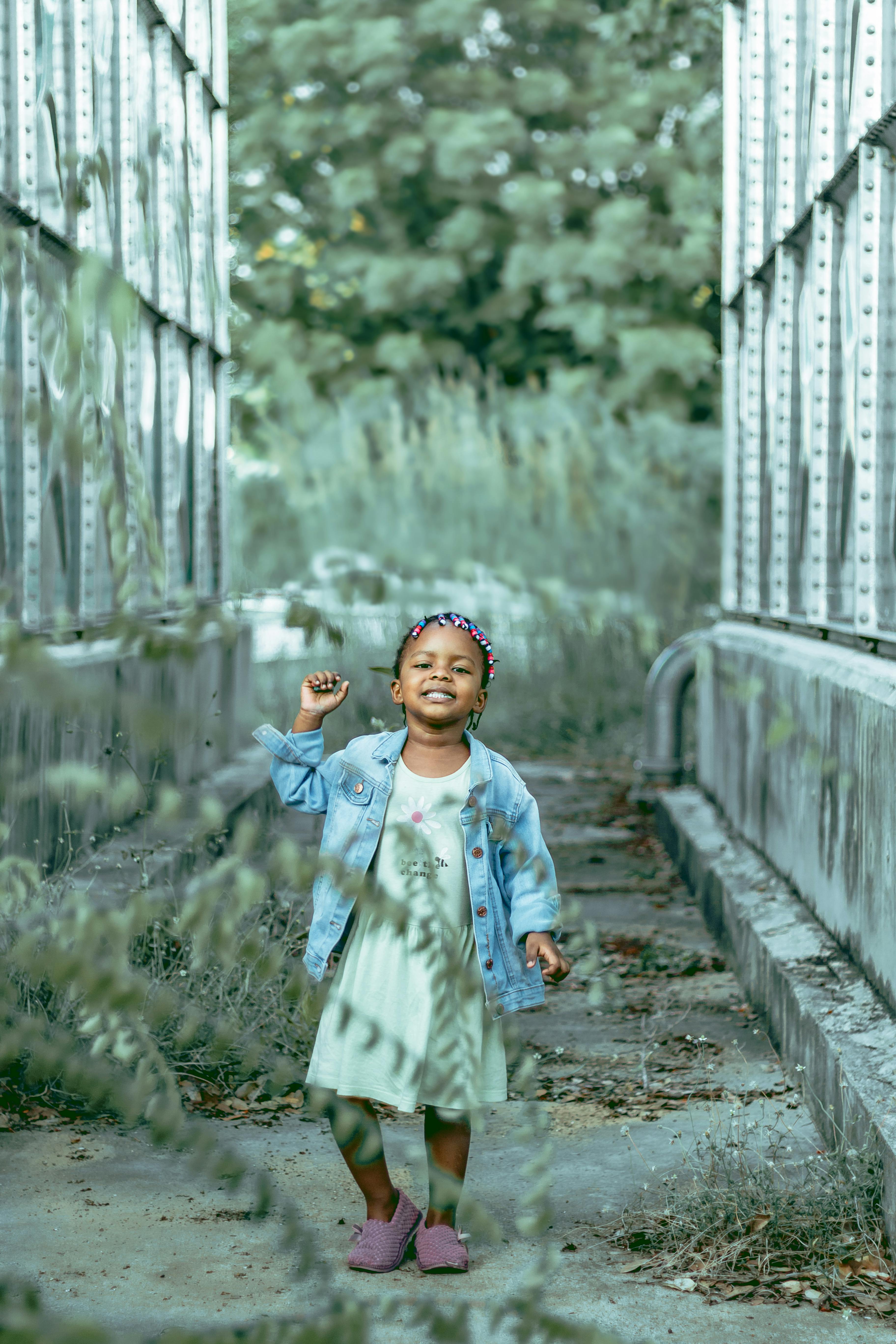 Cute Girl Walking on the Sidewalk · Free Stock Photo