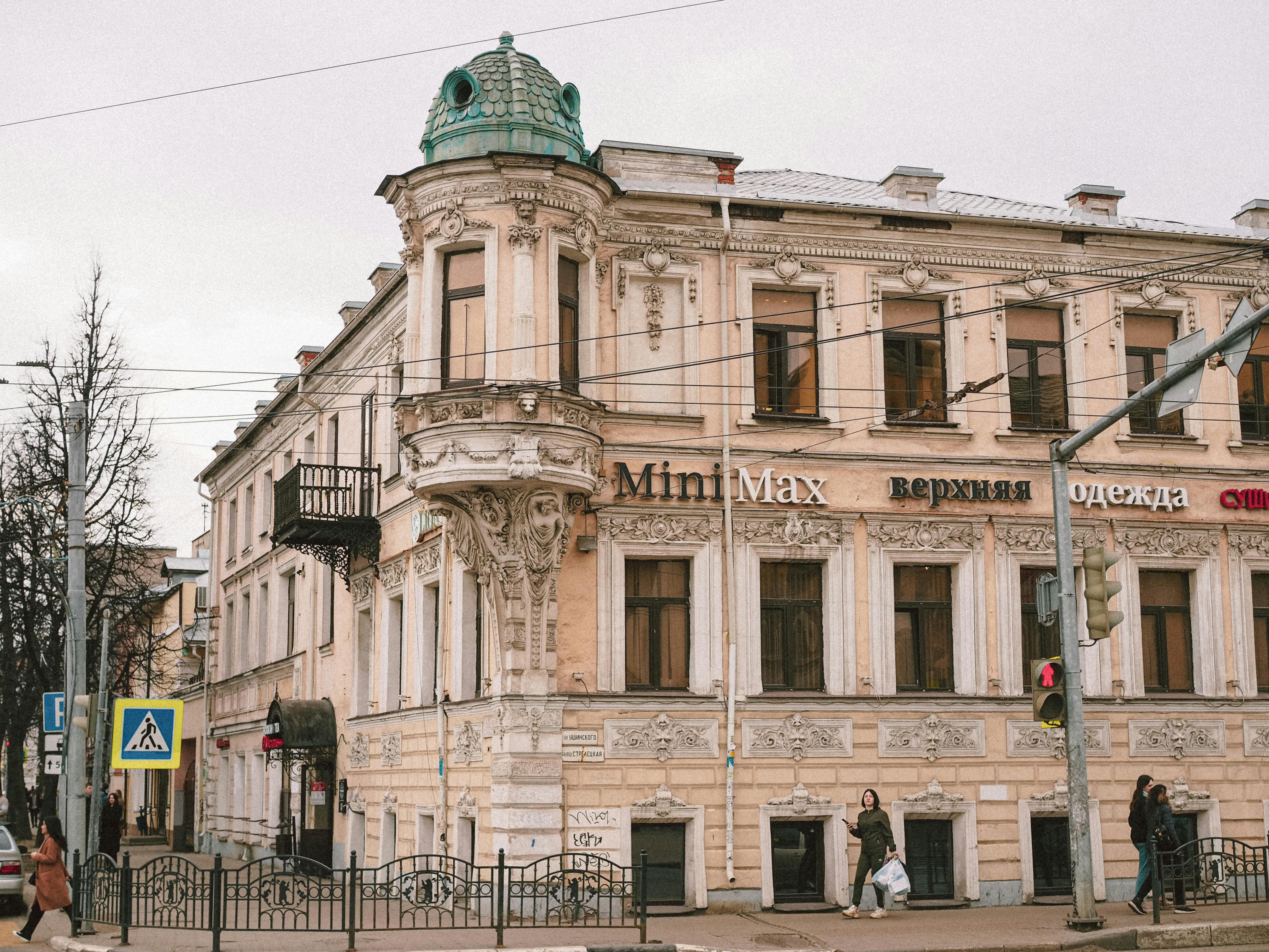People Walking in Front of an Old Building · Free Stock Photo