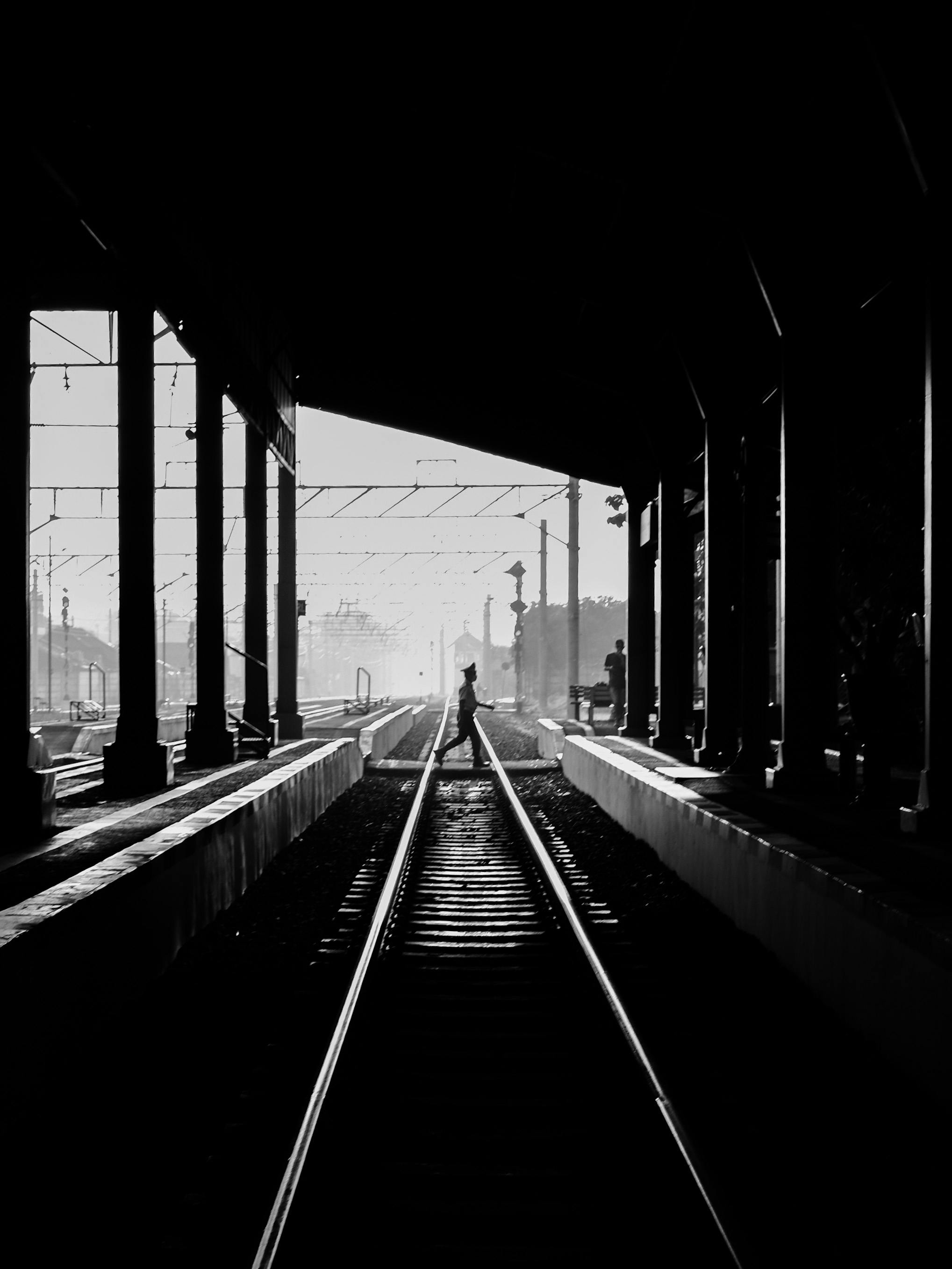 Man in a Distance Crossing the Railway at the Railway Station · Free ...