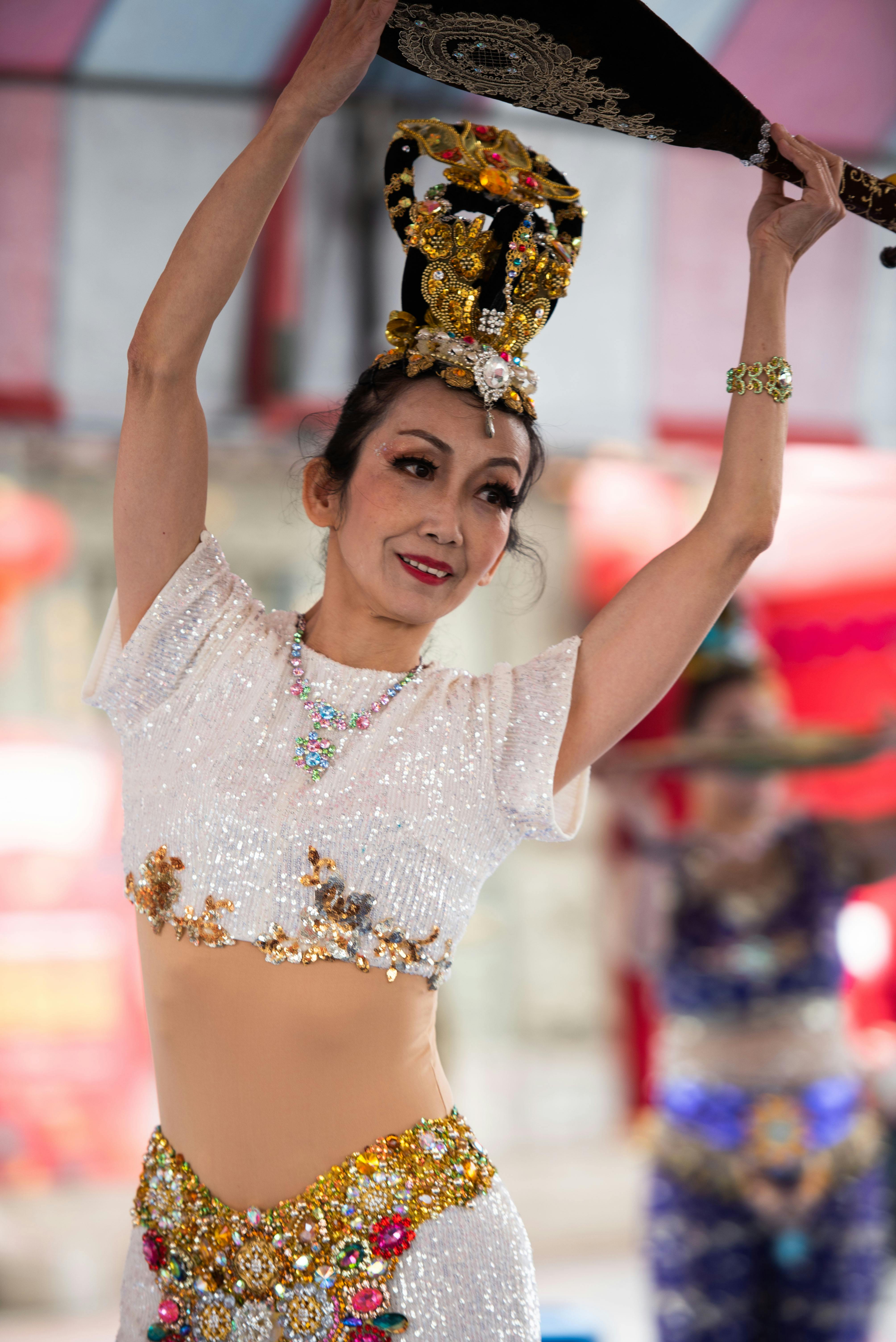 Beautiful Woman Wearing Traditional Clothing Dancing · Free Stock Photo