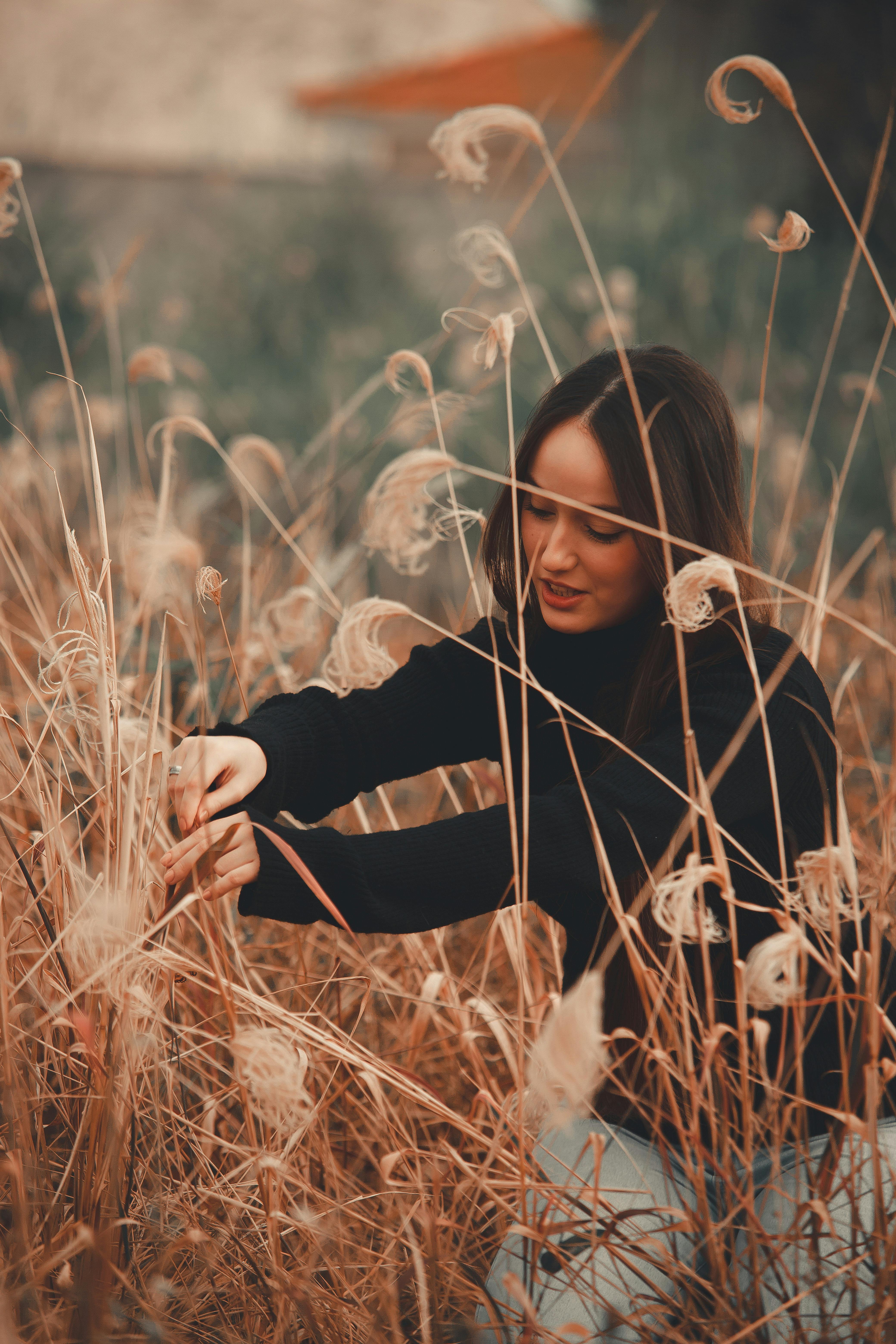 Woman Picking Up Grasses · Free Stock Photo