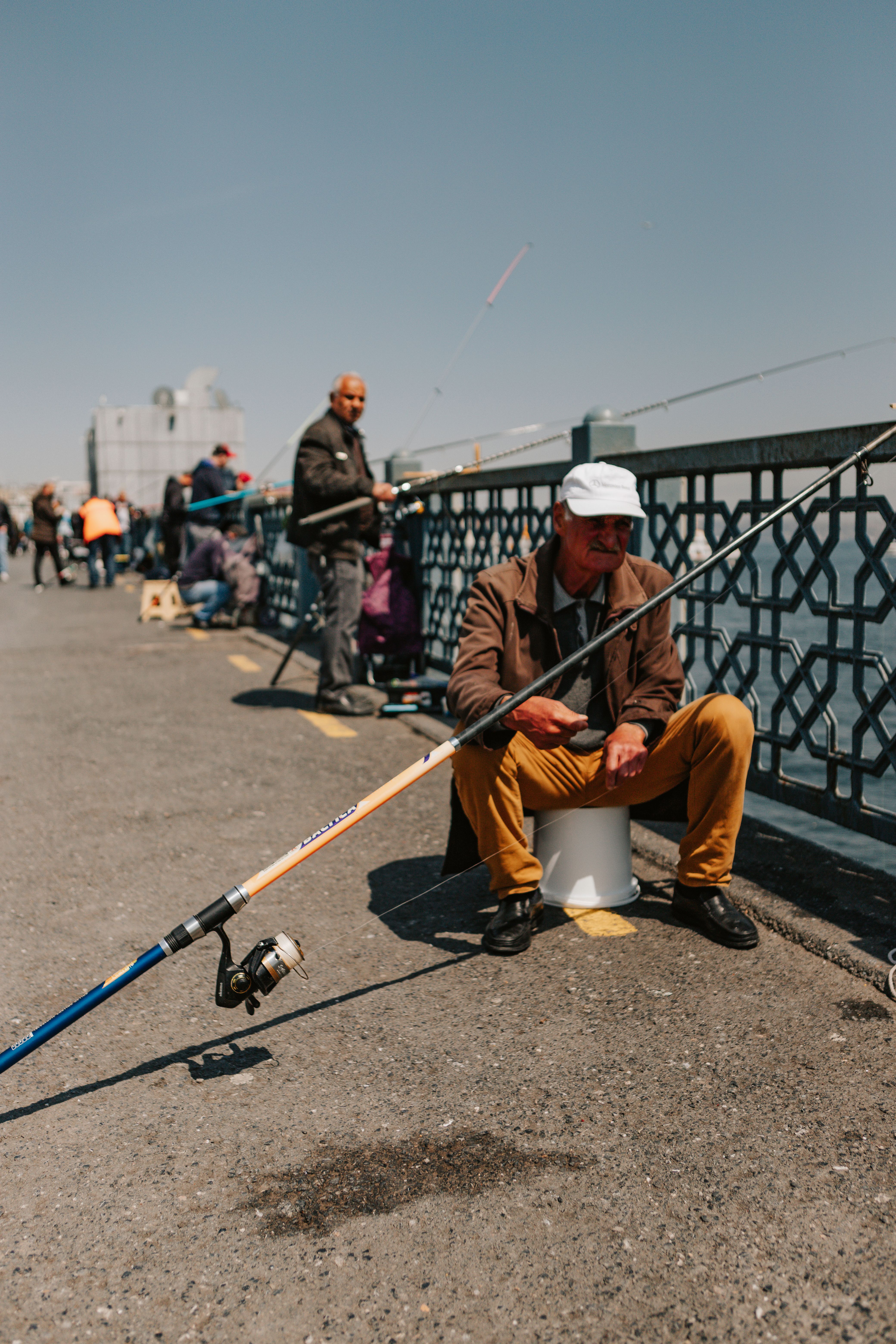 Men Fishing From Bridge · Free Stock Photo