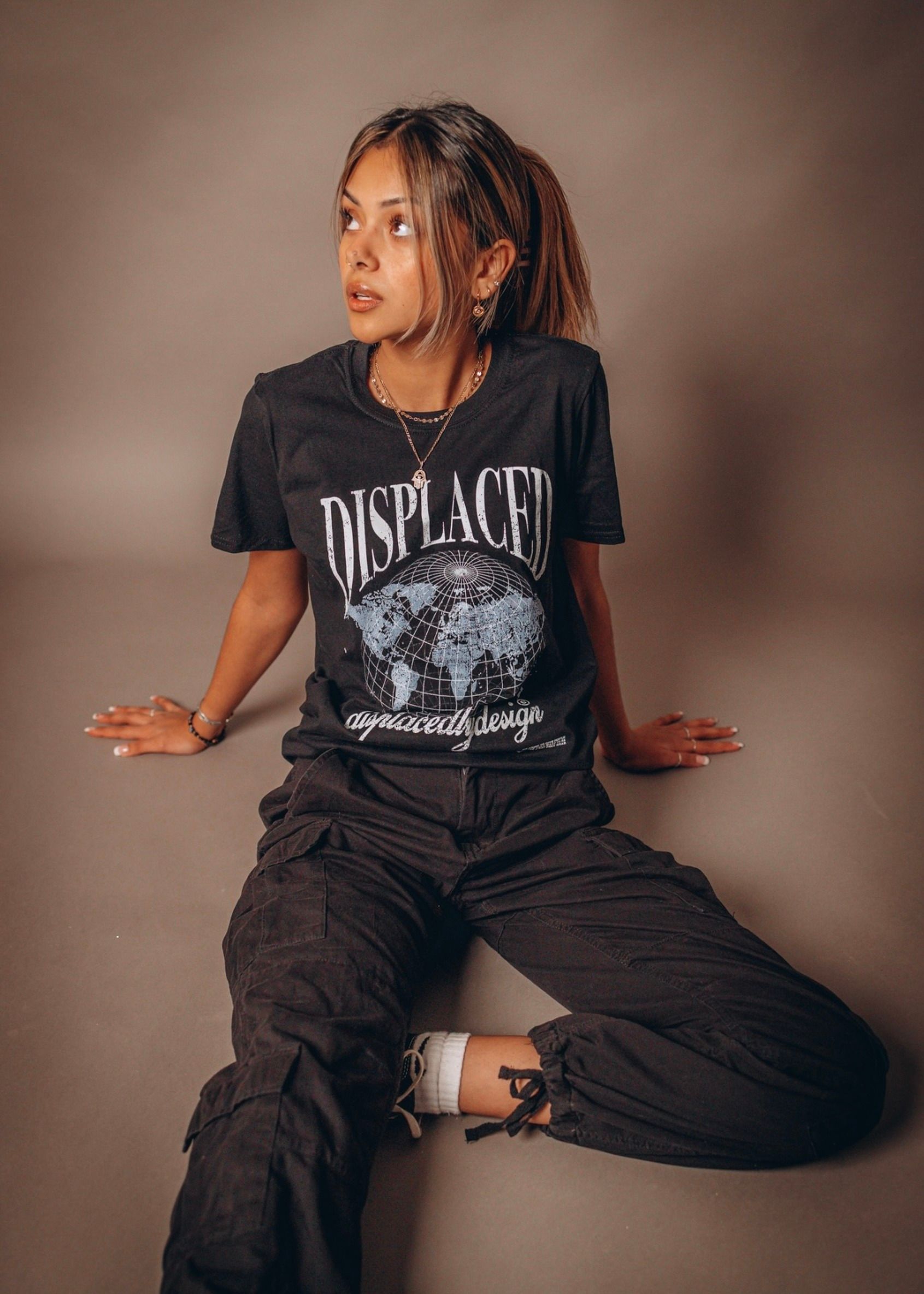 A Young Woman Modeling in Streetwear · Free Stock Photo