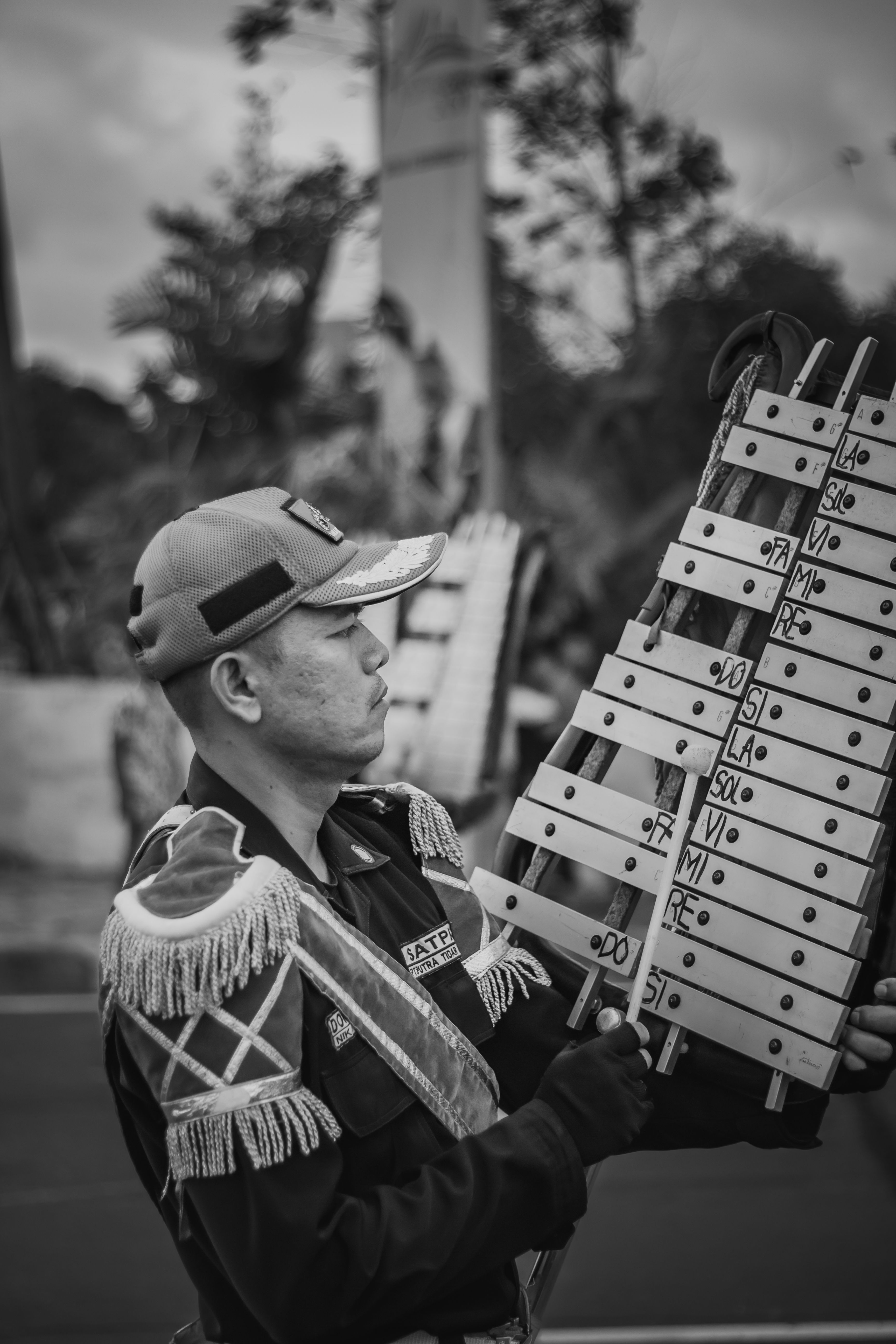 Black and White Photo of a Man Using a Musical Instrument · Free Stock ...