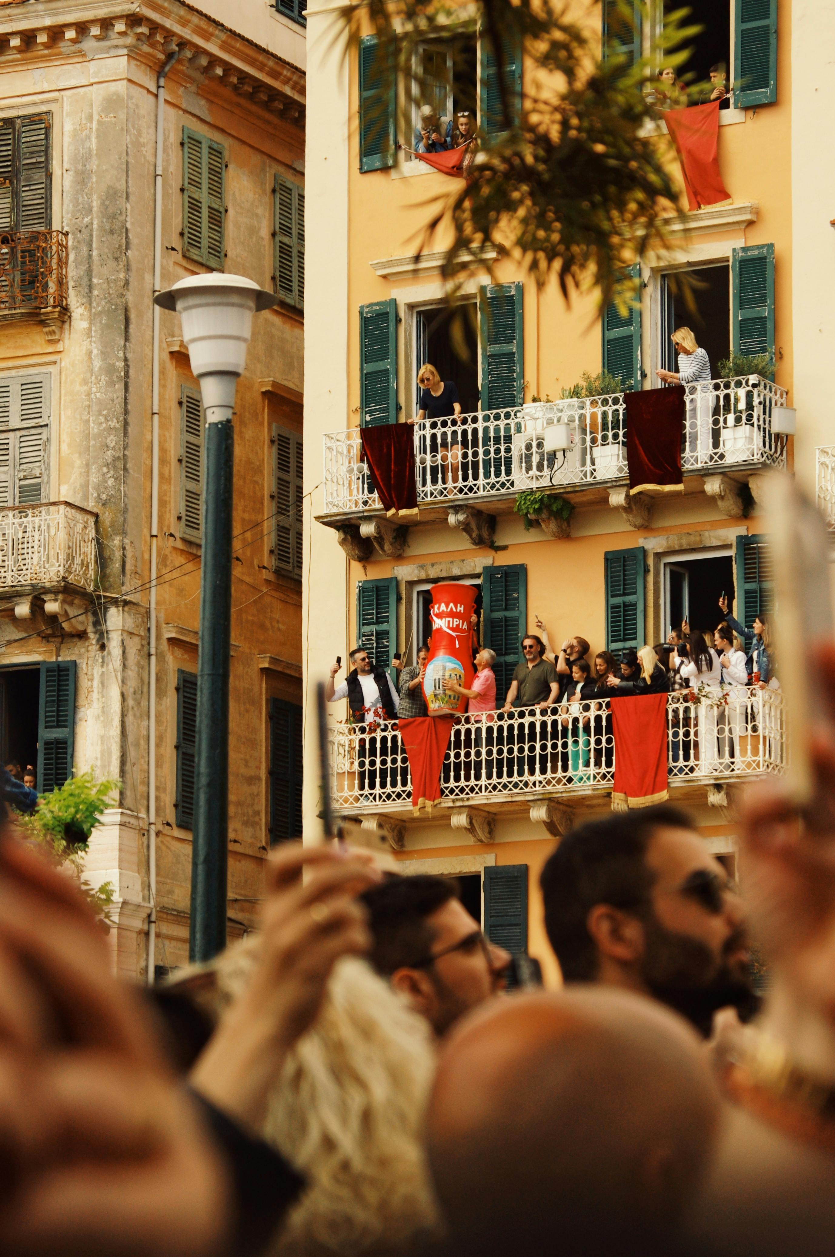 People on Balconies · Free Stock Photo