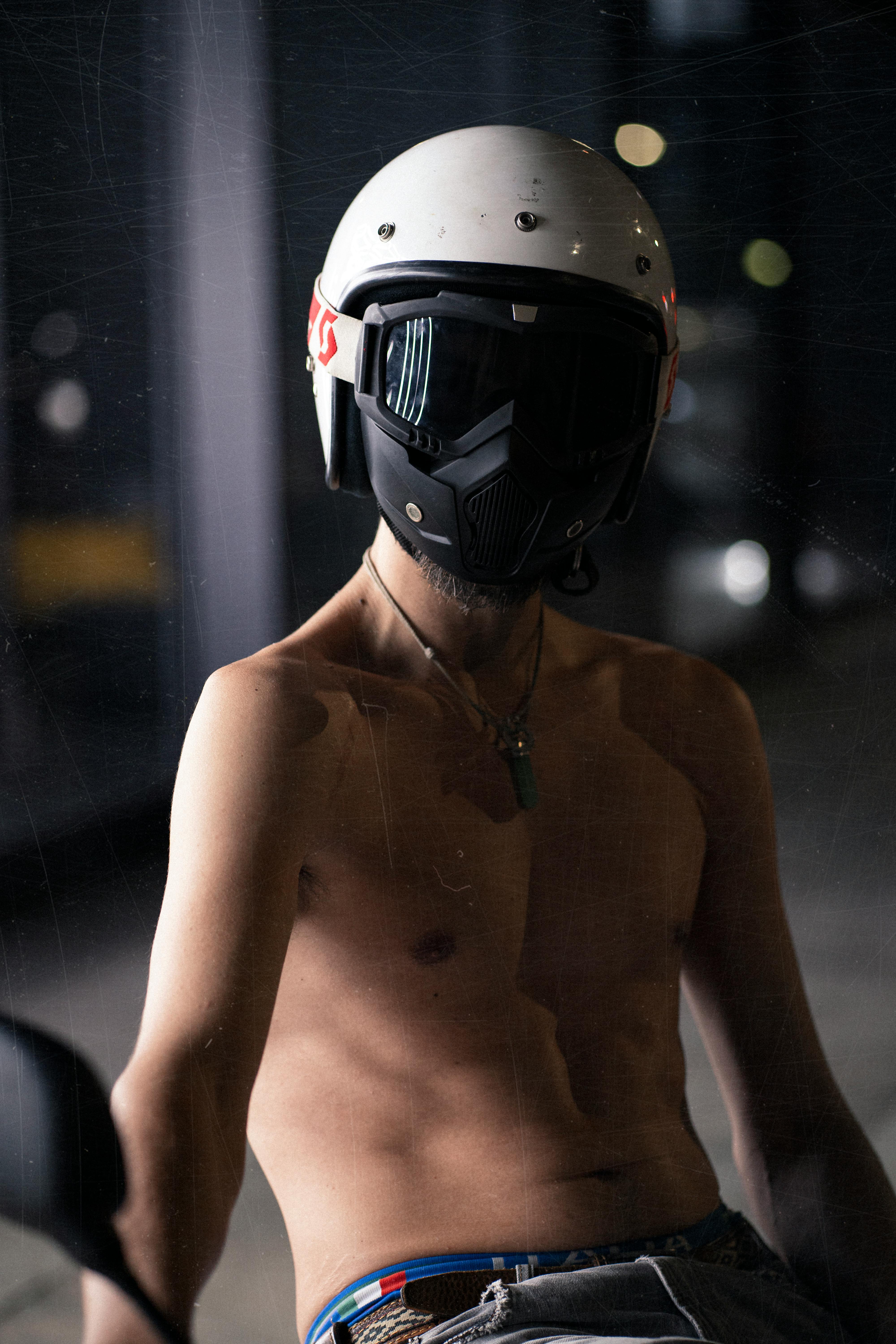 A Shirtless Man Wearing a Helmet · Free Stock Photo