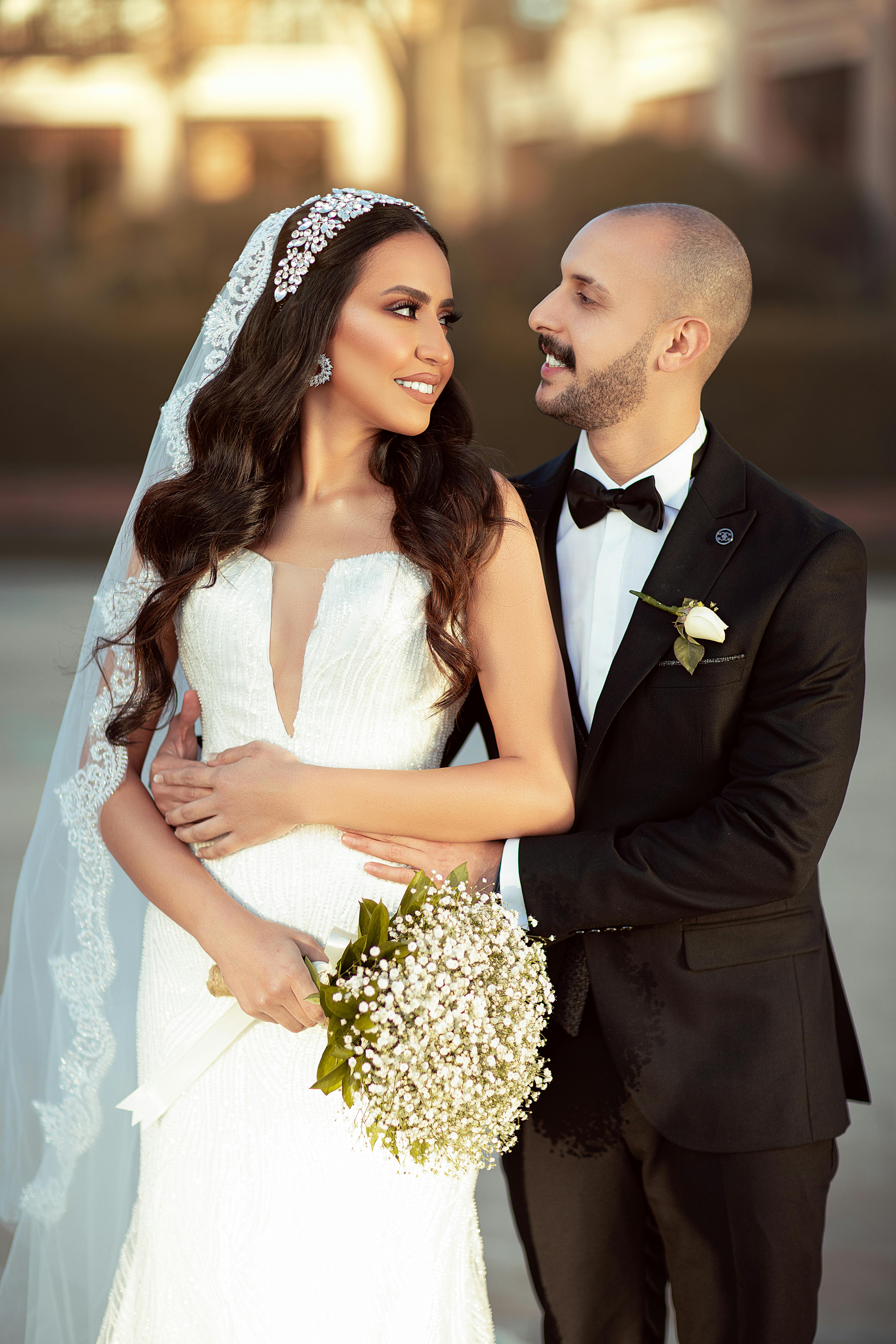 A Newlywed Couple Smiling at Each Other · Free Stock Photo