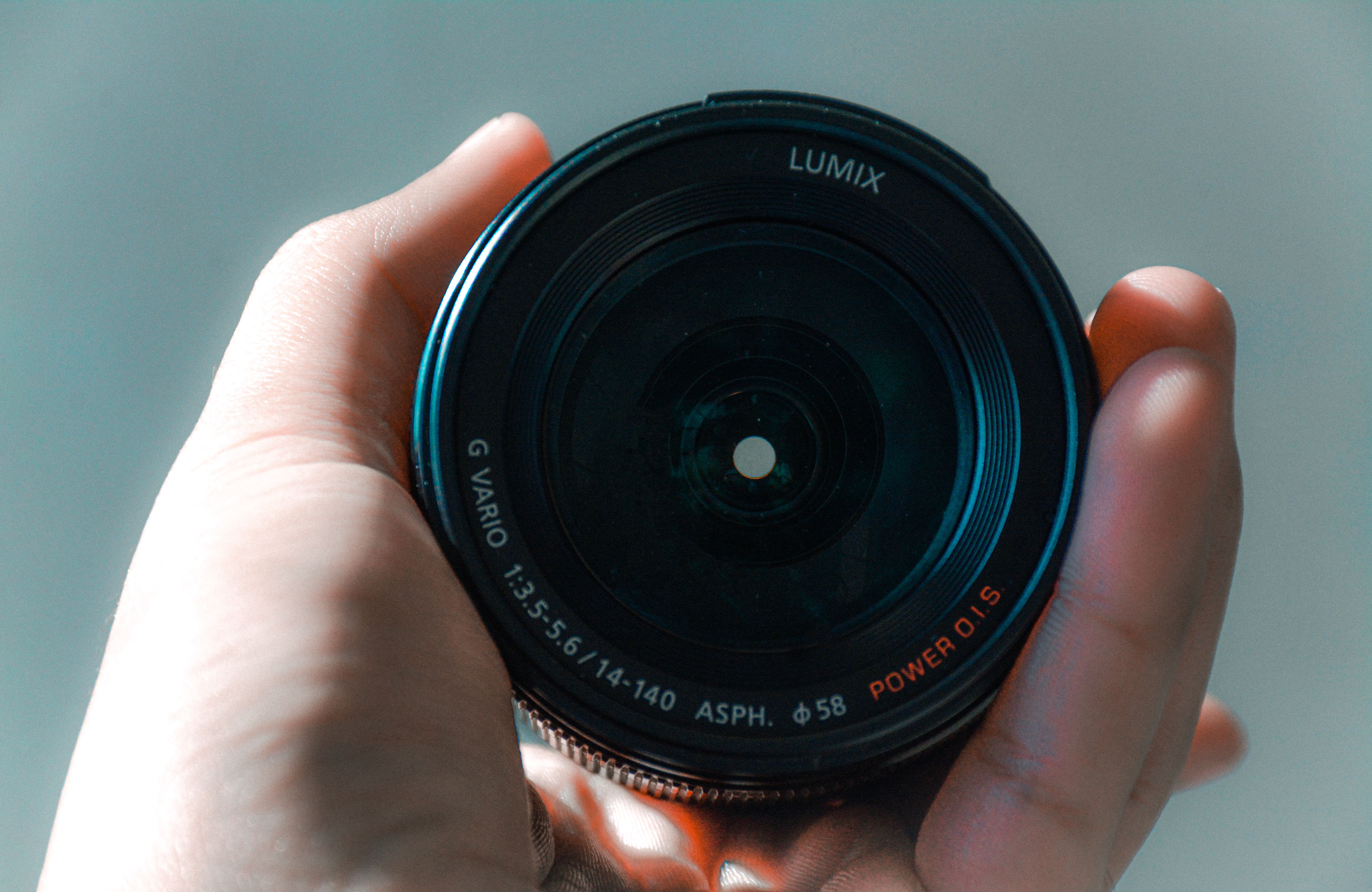 Black Canon Zoom Lens Leaning on Book · Free Stock Photo