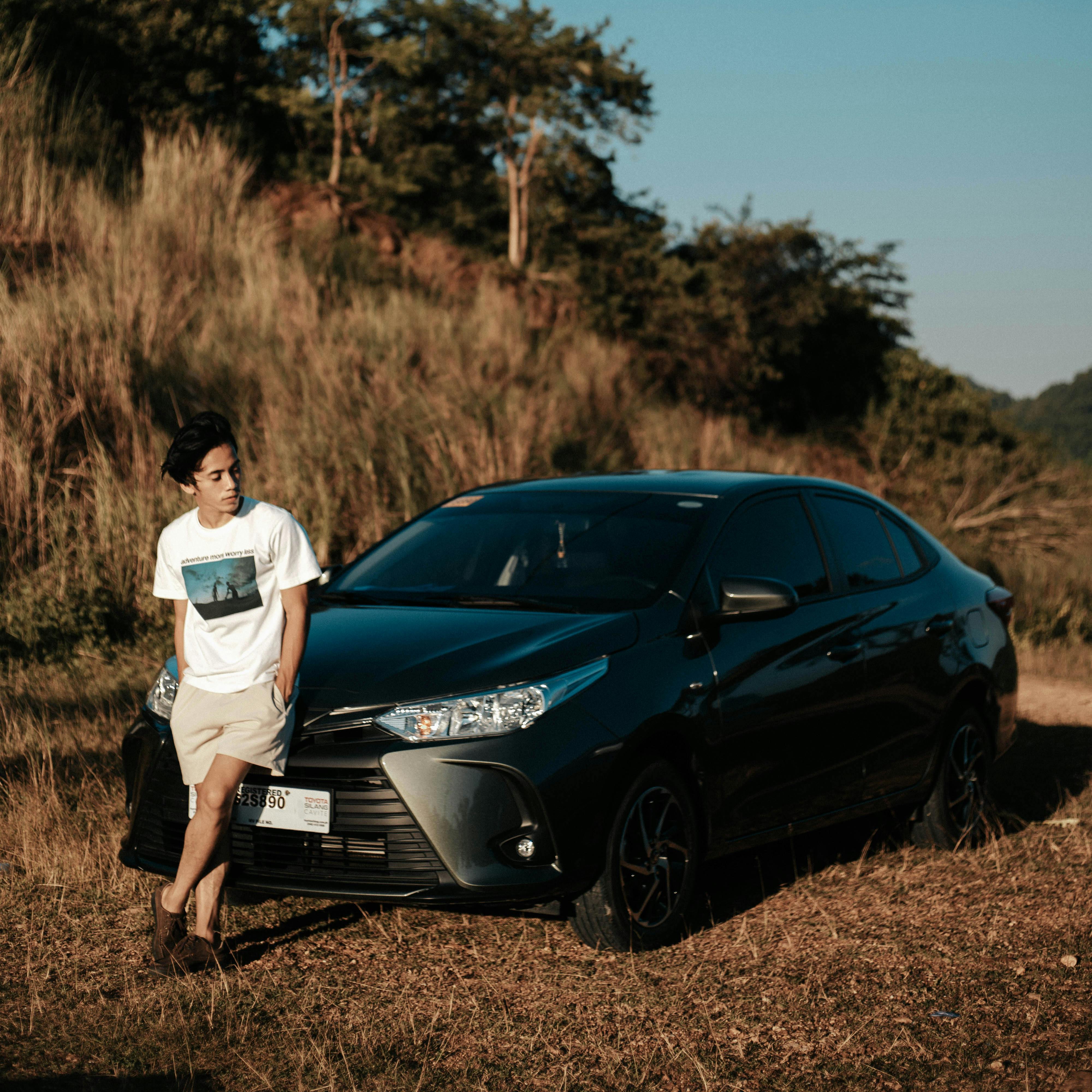 Man Leaning on a Car · Free Stock Photo