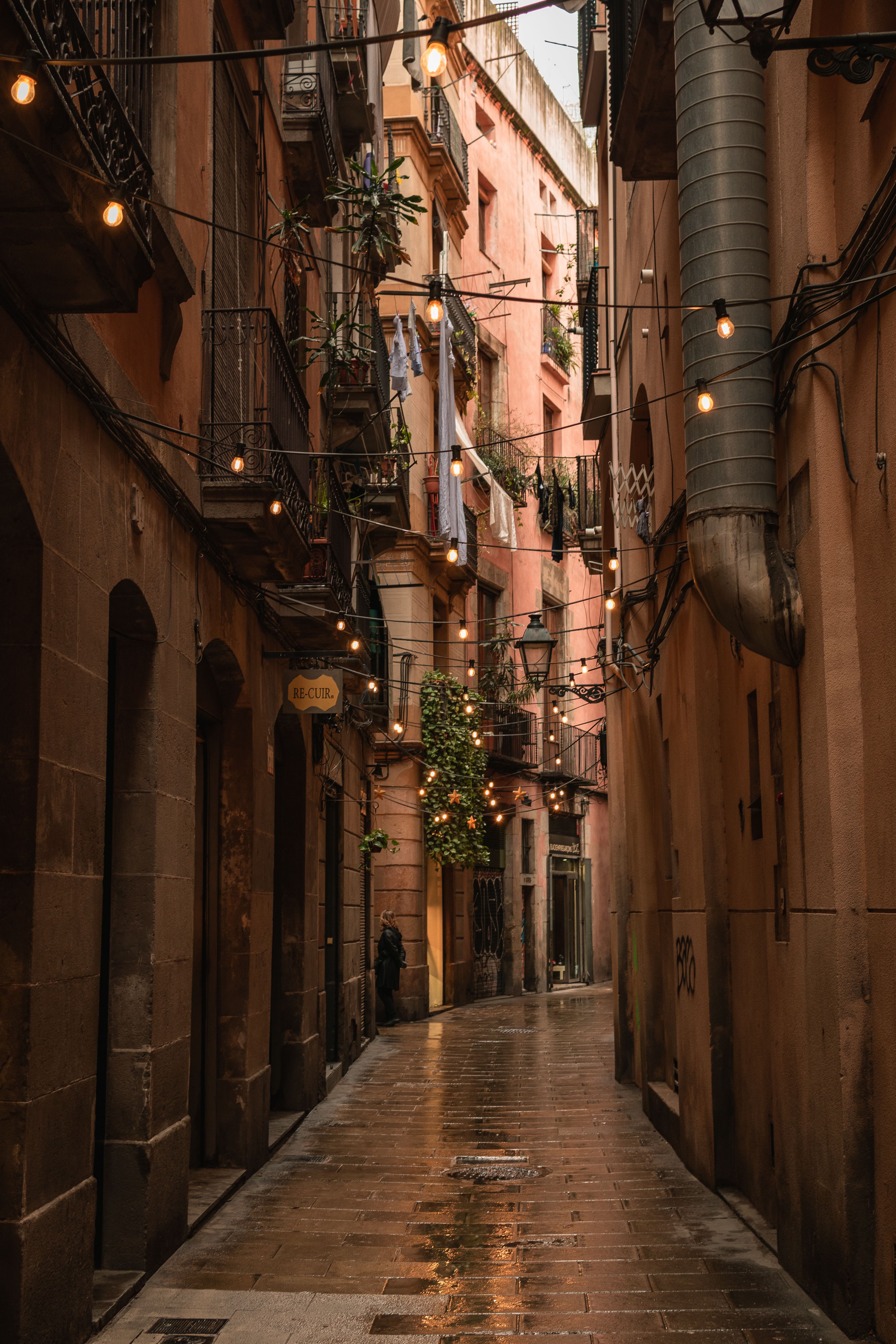 Person Walking on Concrete Alleyway at Night T · Free Stock Photo