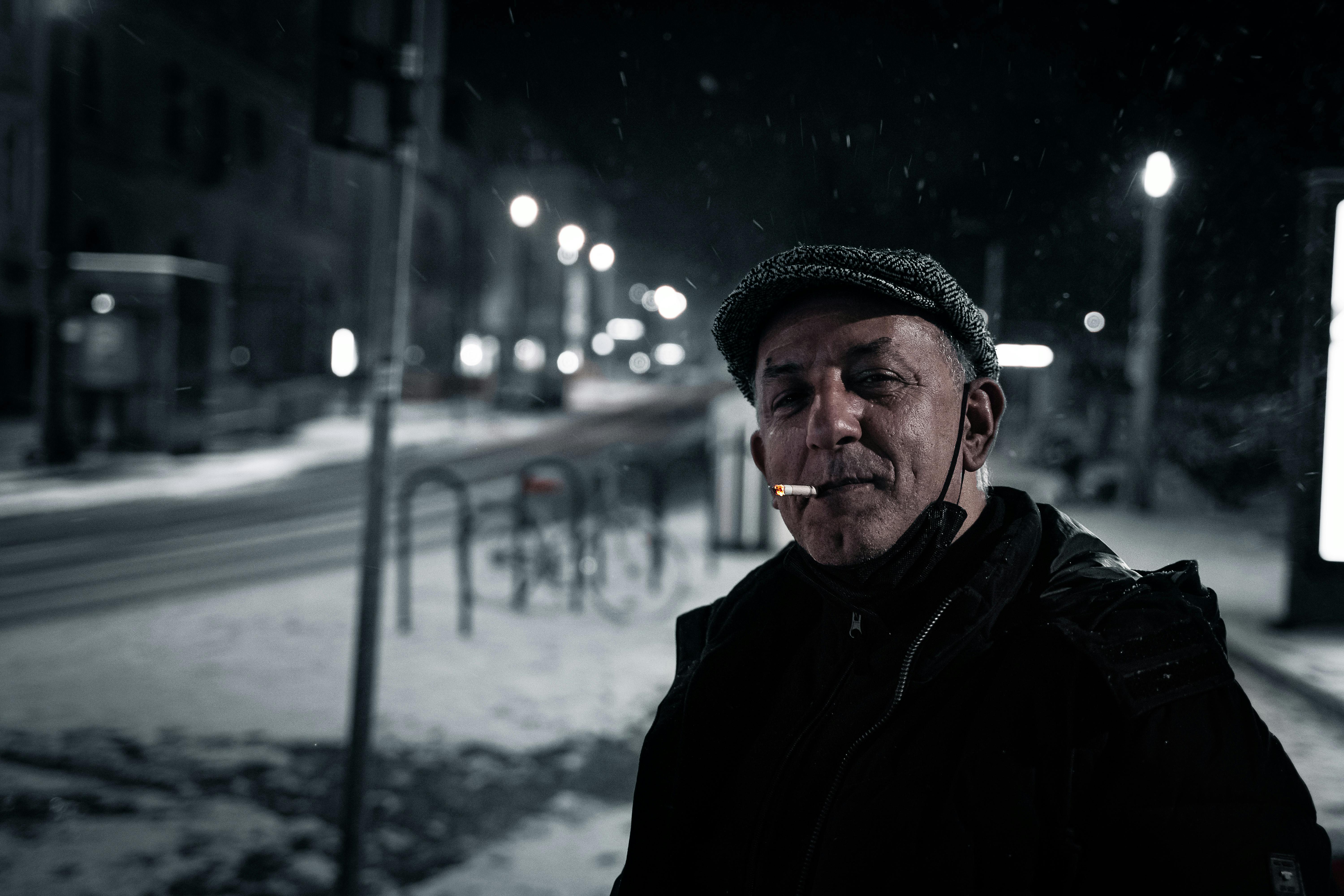 A Man Smoking While Snowing · Free Stock Photo
