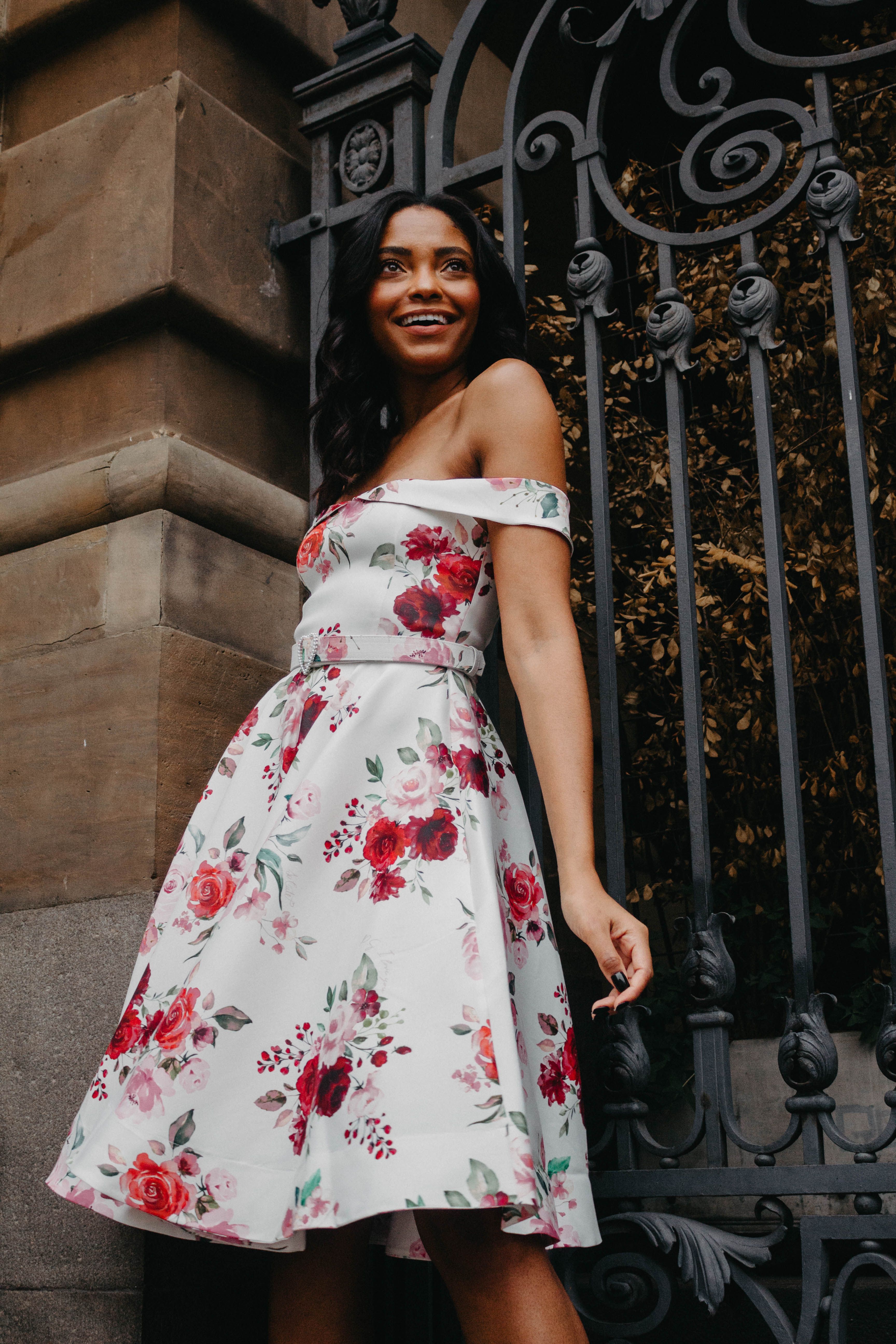 Woman in Floral Dress Smiling · Free Stock Photo