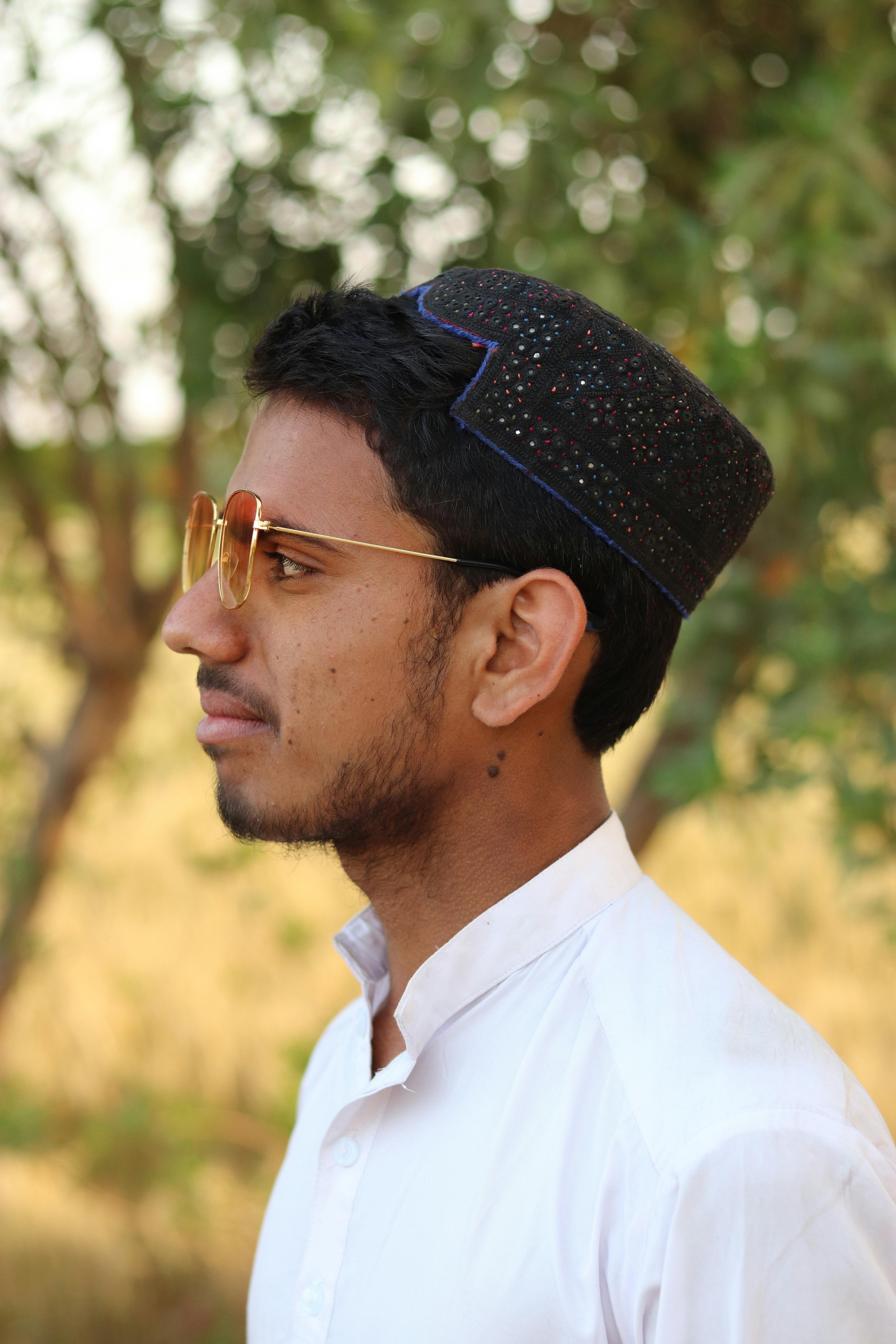 Man in White Shirt Wearing Cap · Free Stock Photo