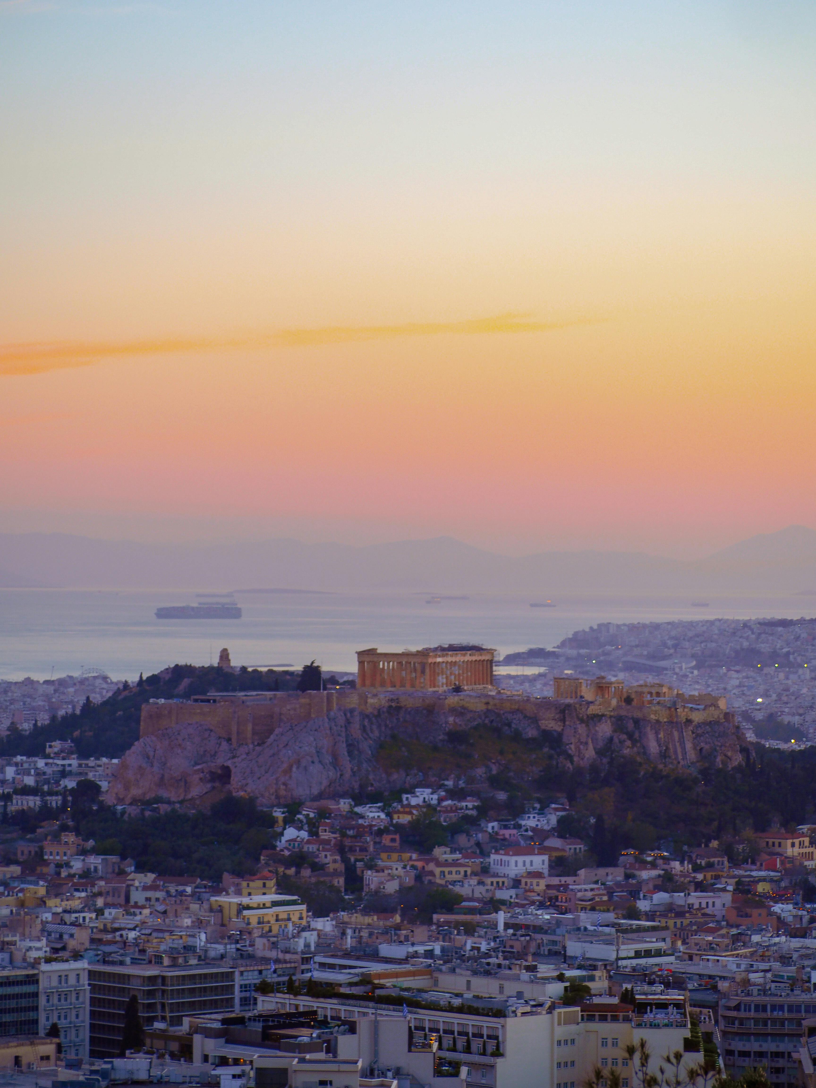 Empty Road Between Concrete Houses Under Blue Sky · Free Stock Photo