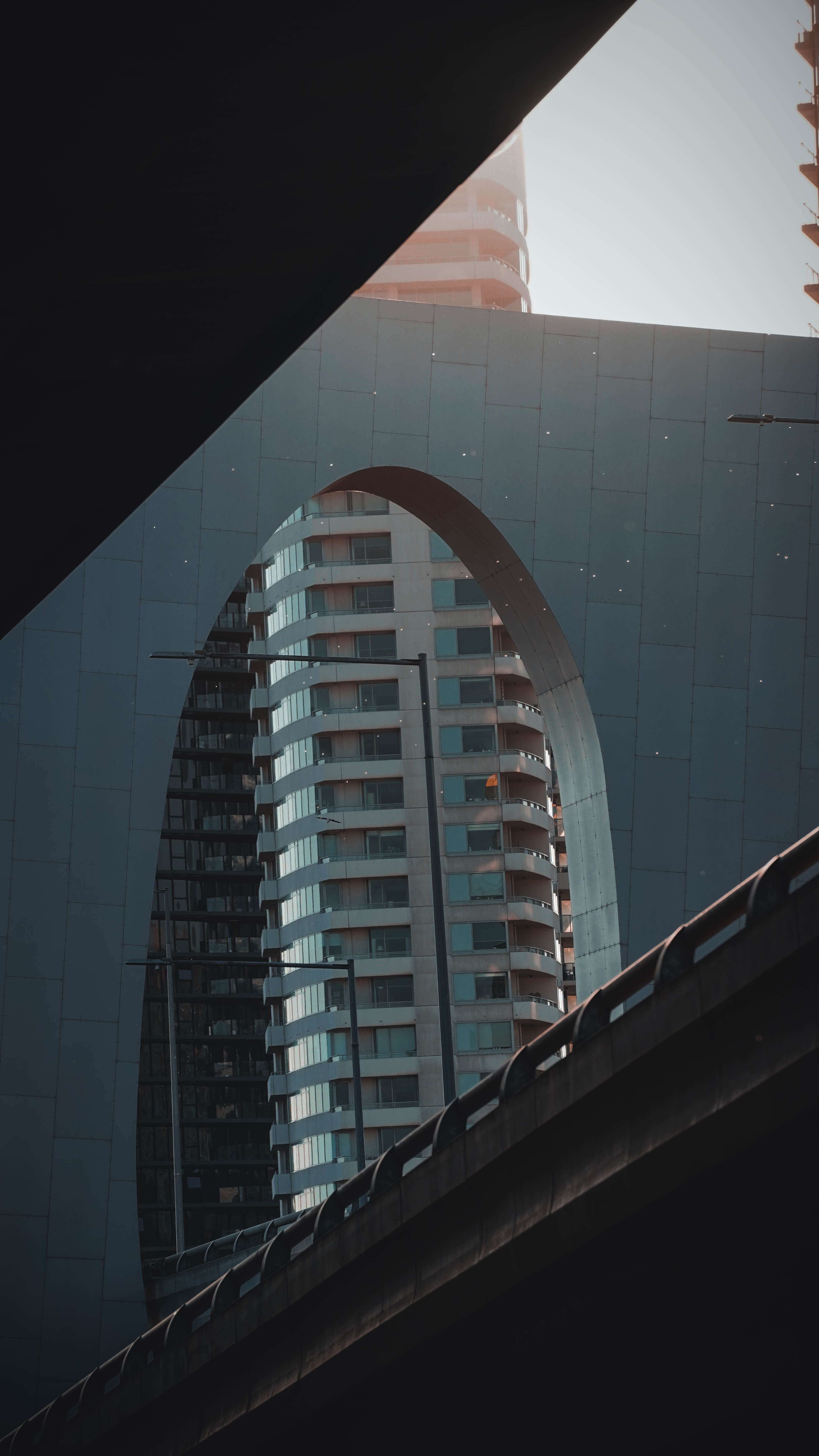 Modern Urban Architecture Underneath Highway · Free Stock Photo