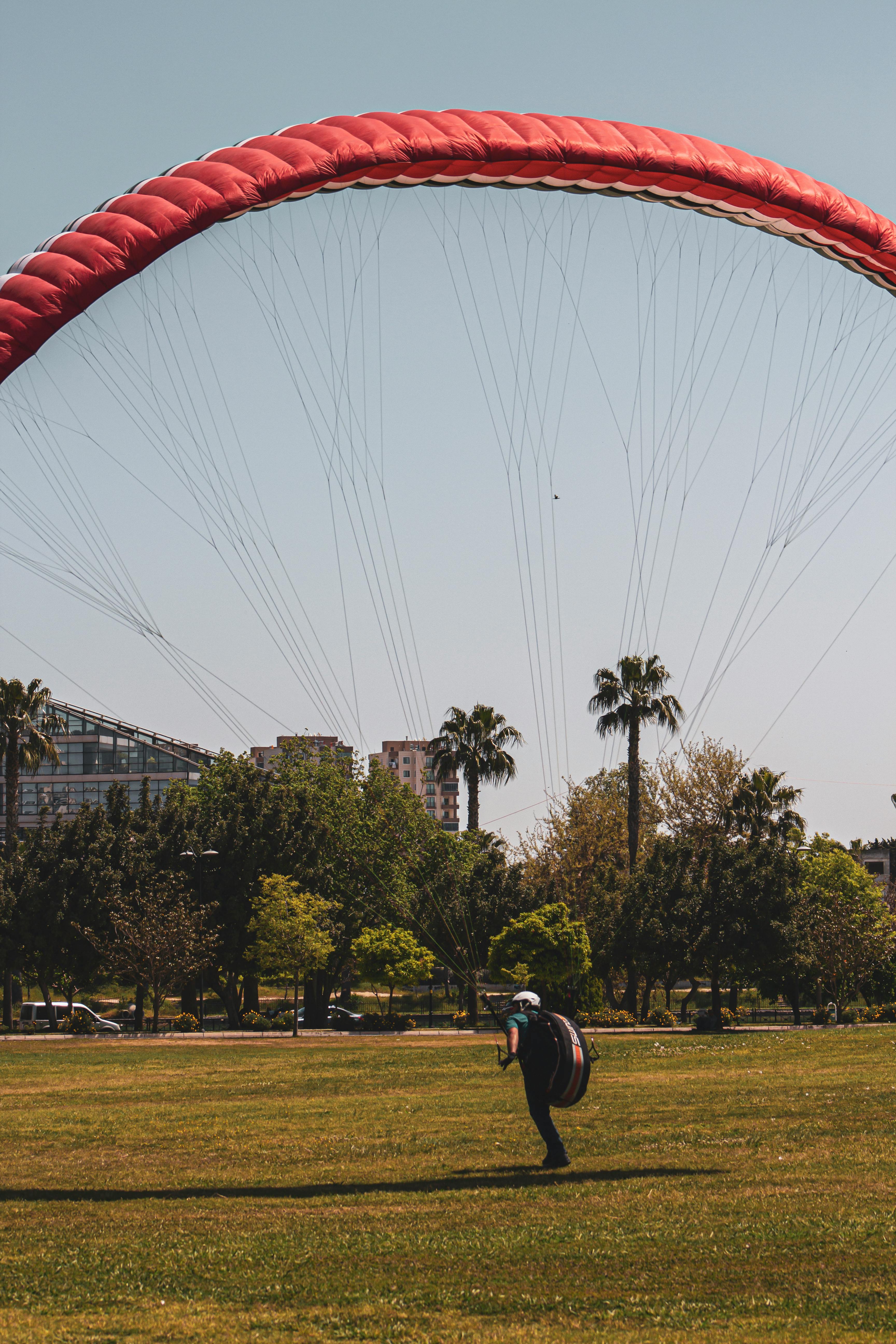 Person Riding on Parachute · Free Stock Photo