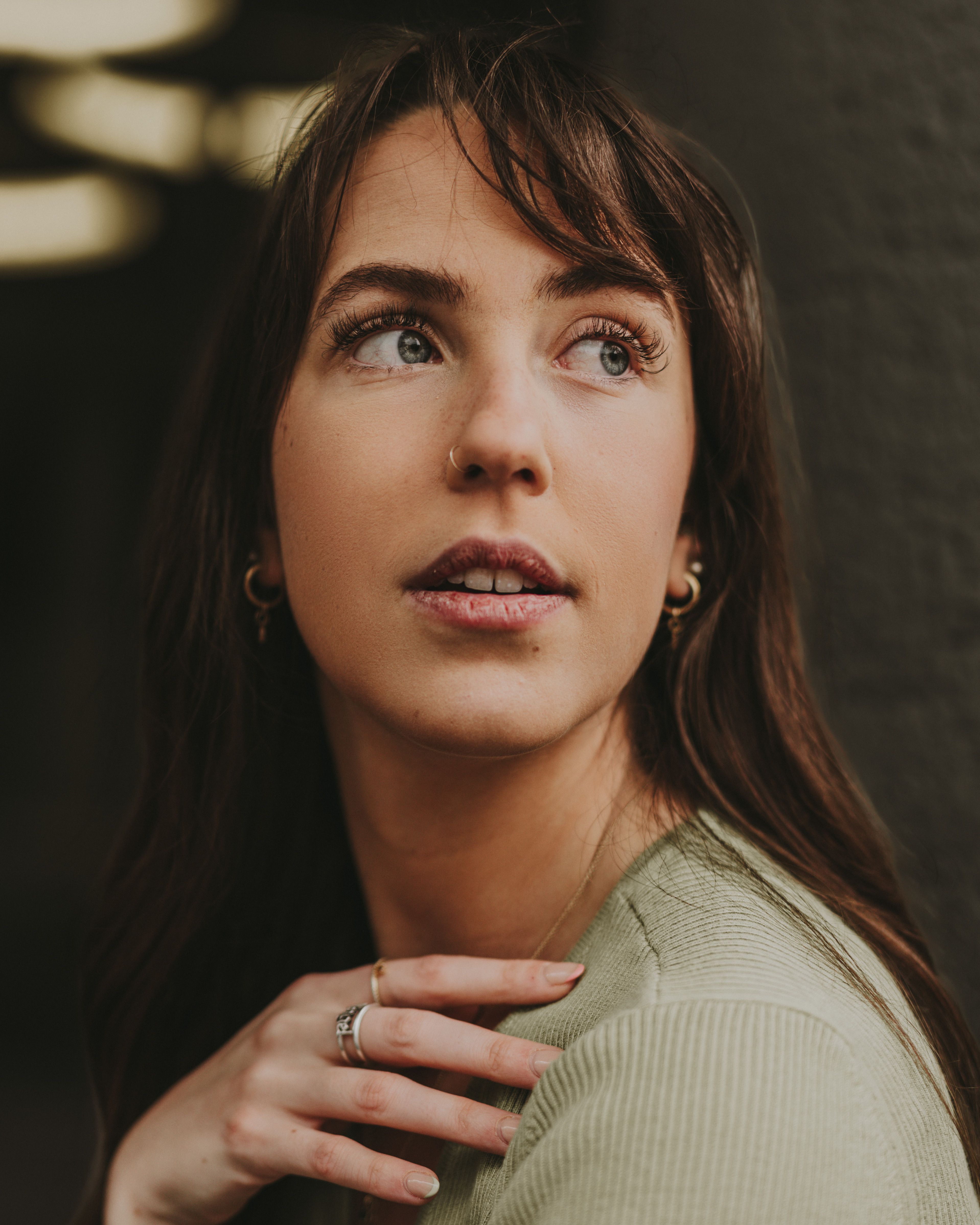 Portrait of a Brunette Woman Looking Back · Free Stock Photo