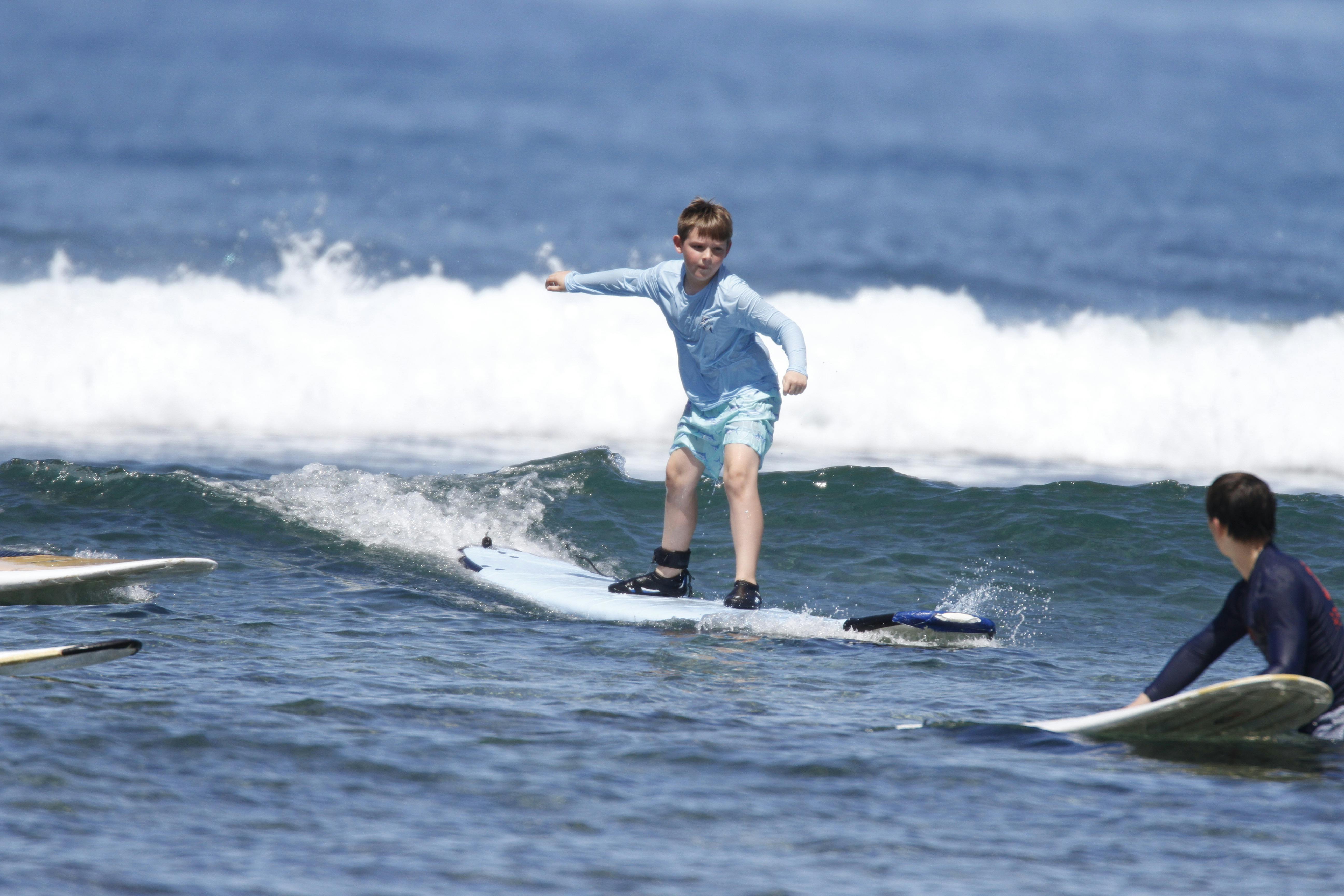Close-Up Photo of Person Carrying Surfboard · Free Stock Photo
