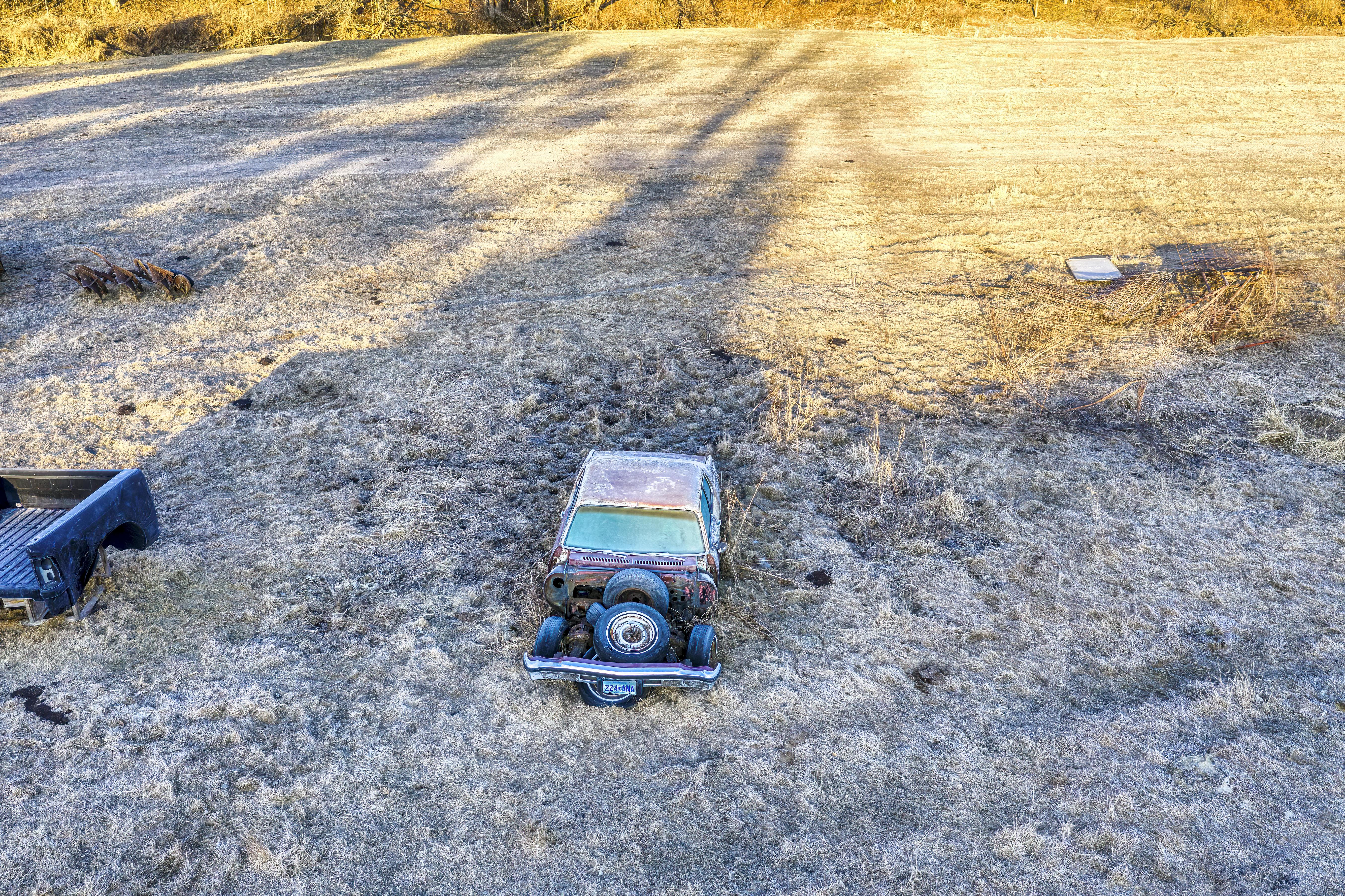 Junk Car on Brown Grass Field · Free Stock Photo