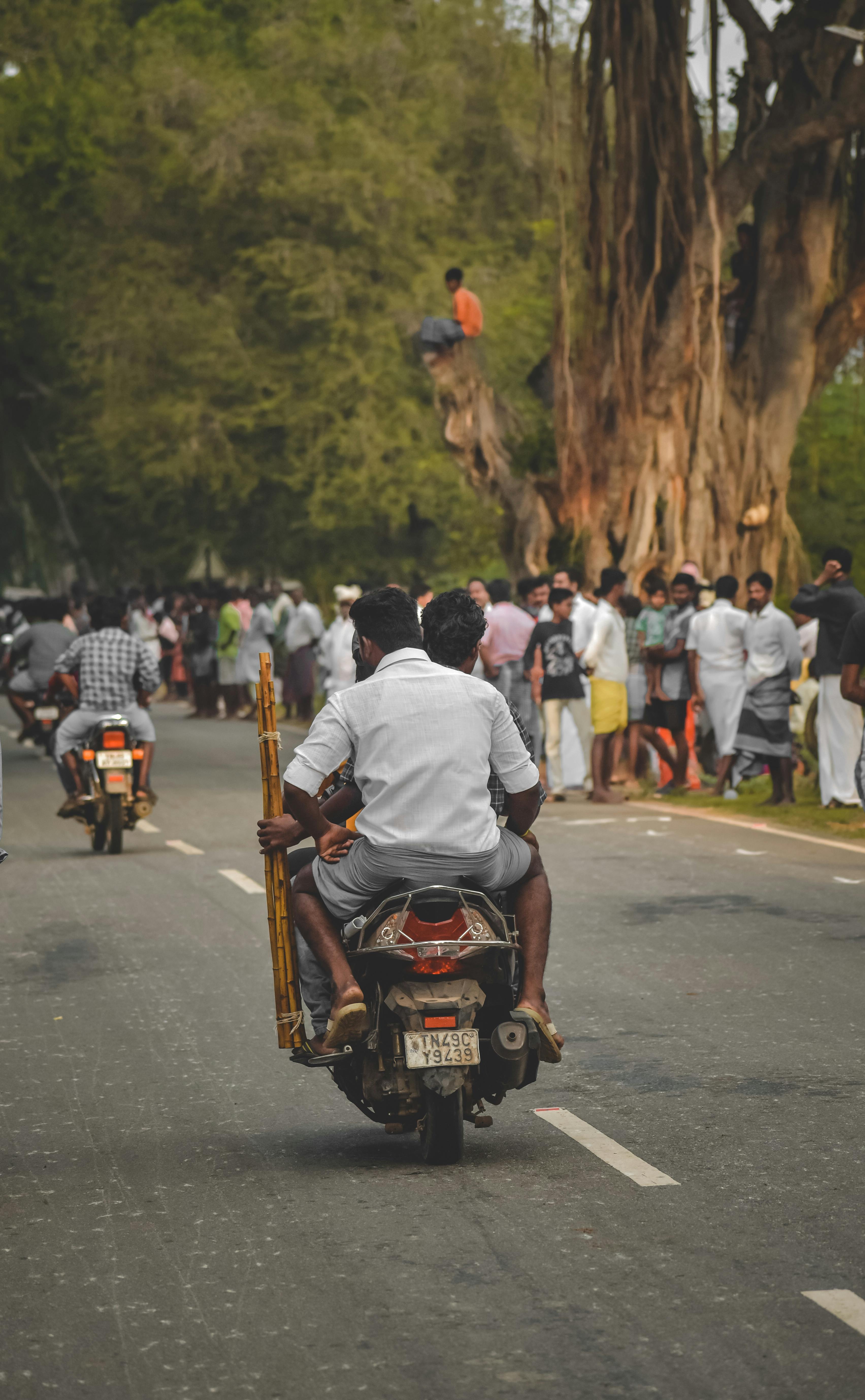 People Riding Motorcycle on the Bridge · Free Stock Photo