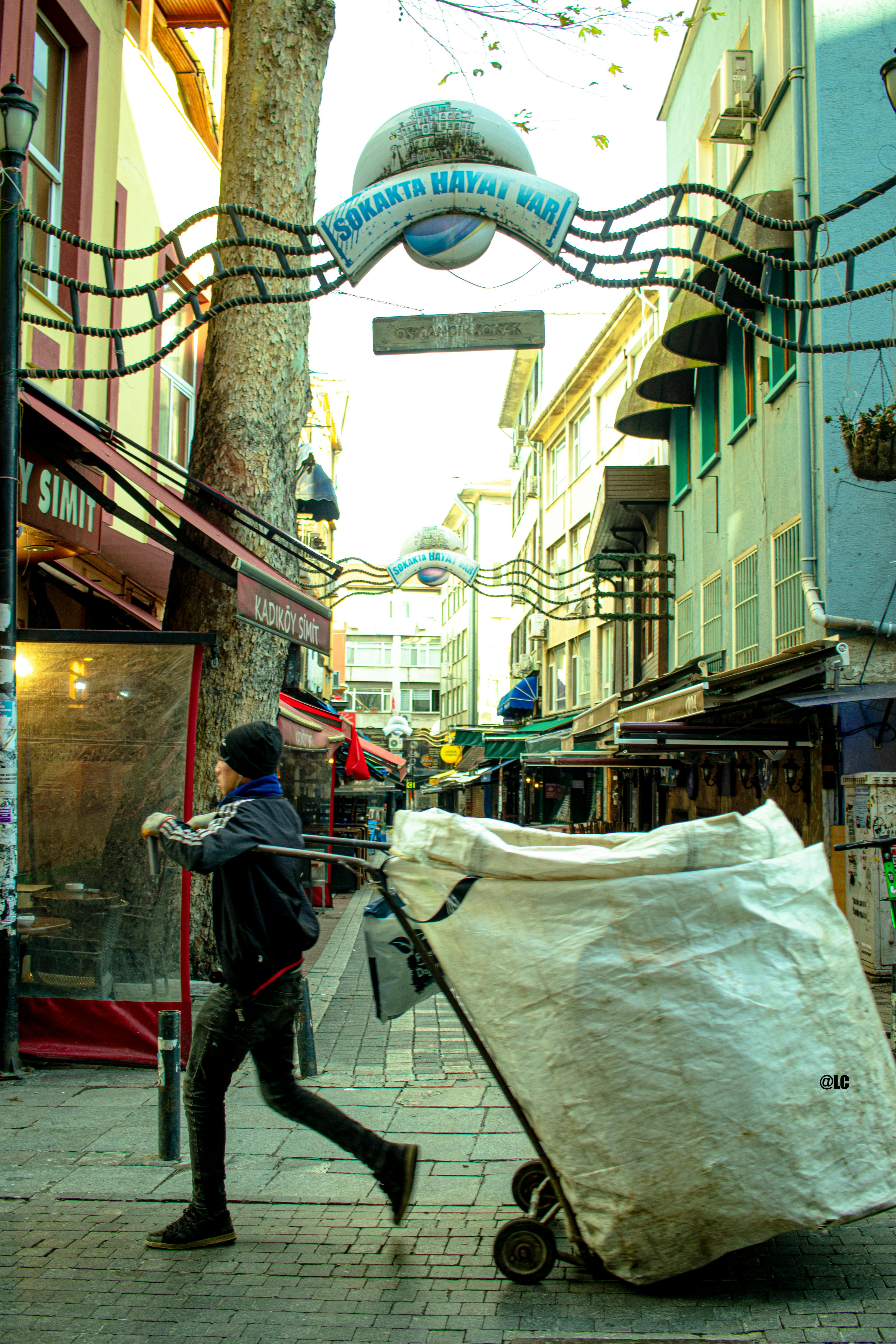 Man Pulling Bag in City · Free Stock Photo