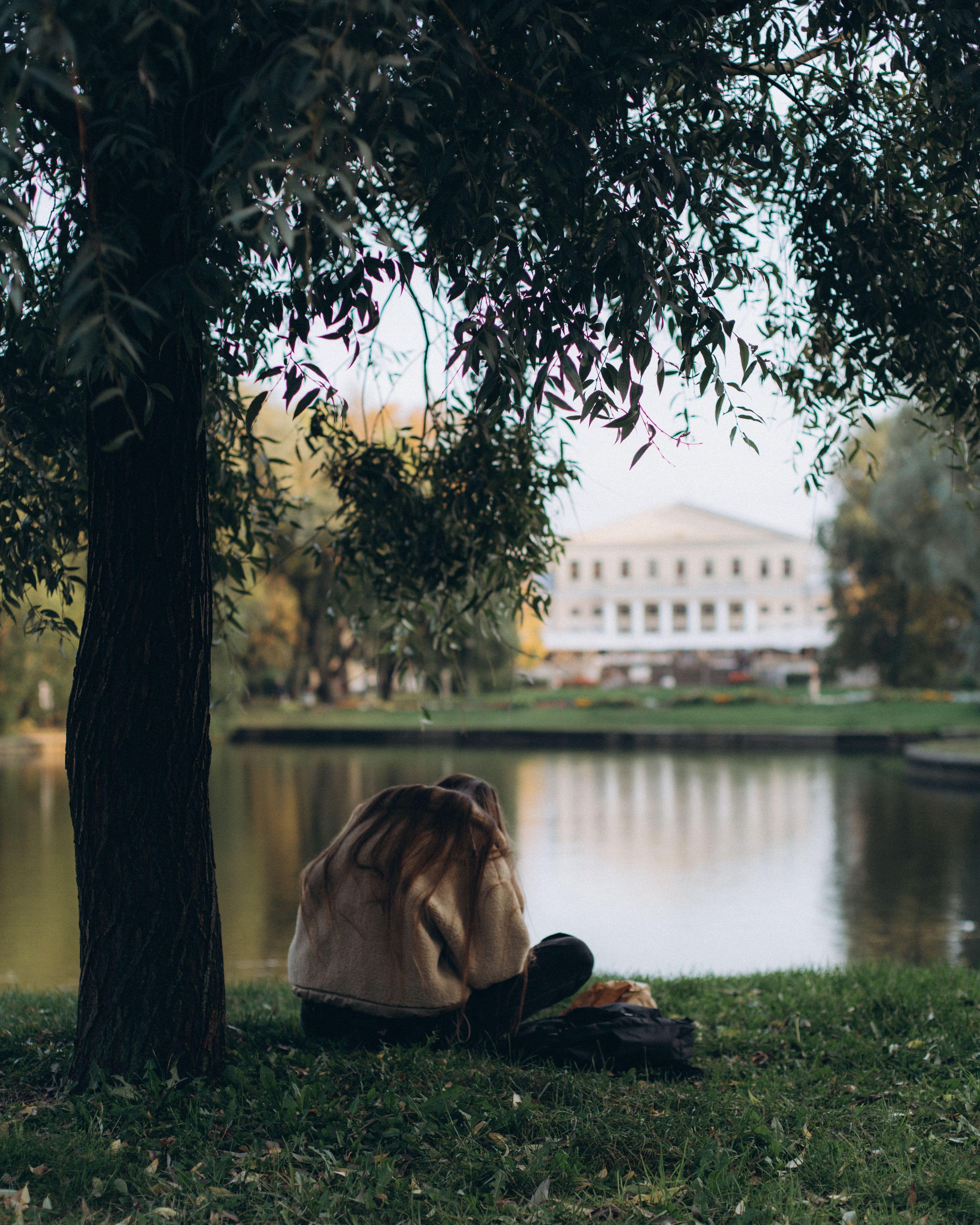 Person Dipping Her Legs on Lake Water · Free Stock Photo