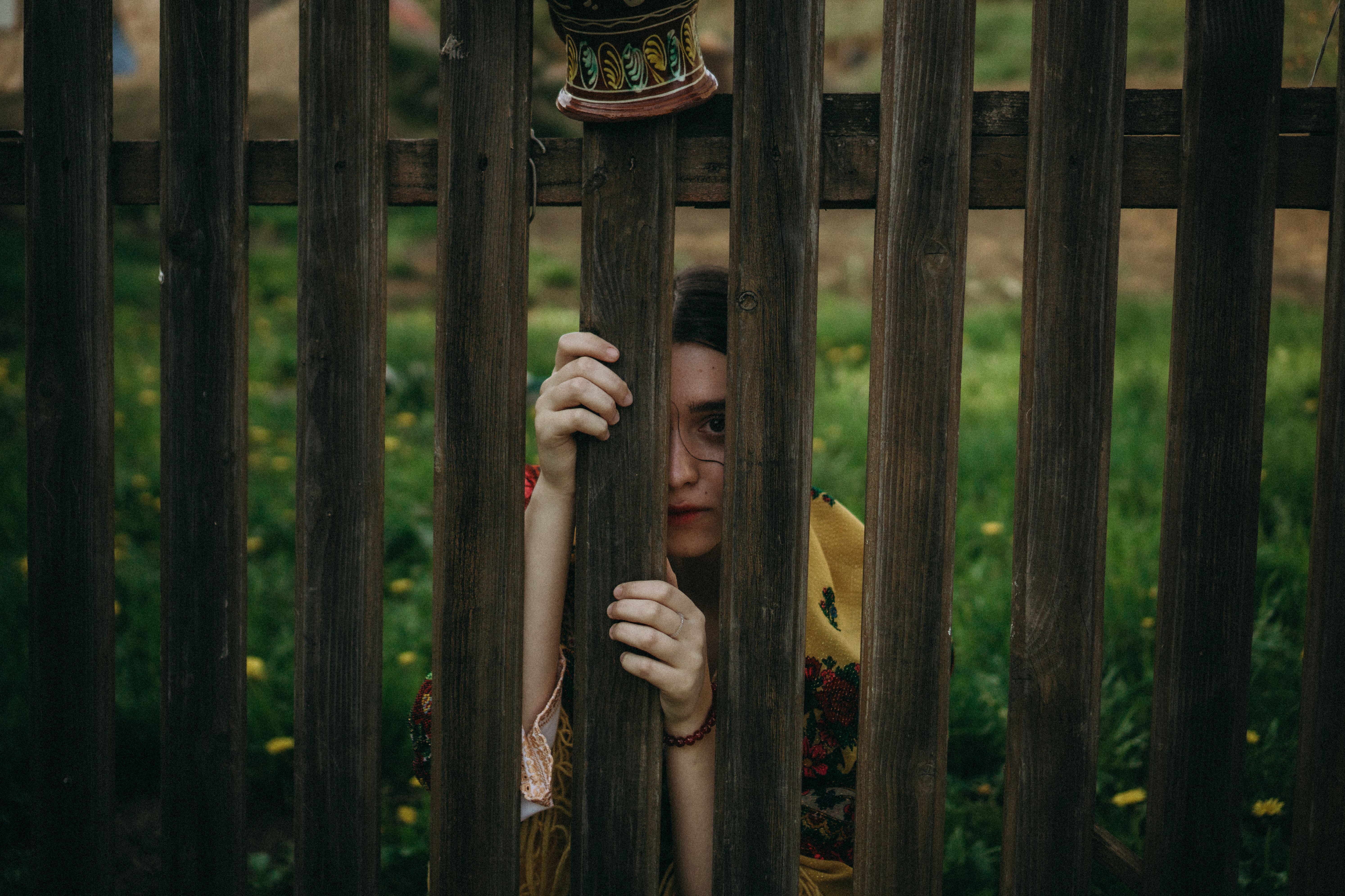 Woman Behind Wooden Fence · Free Stock Photo