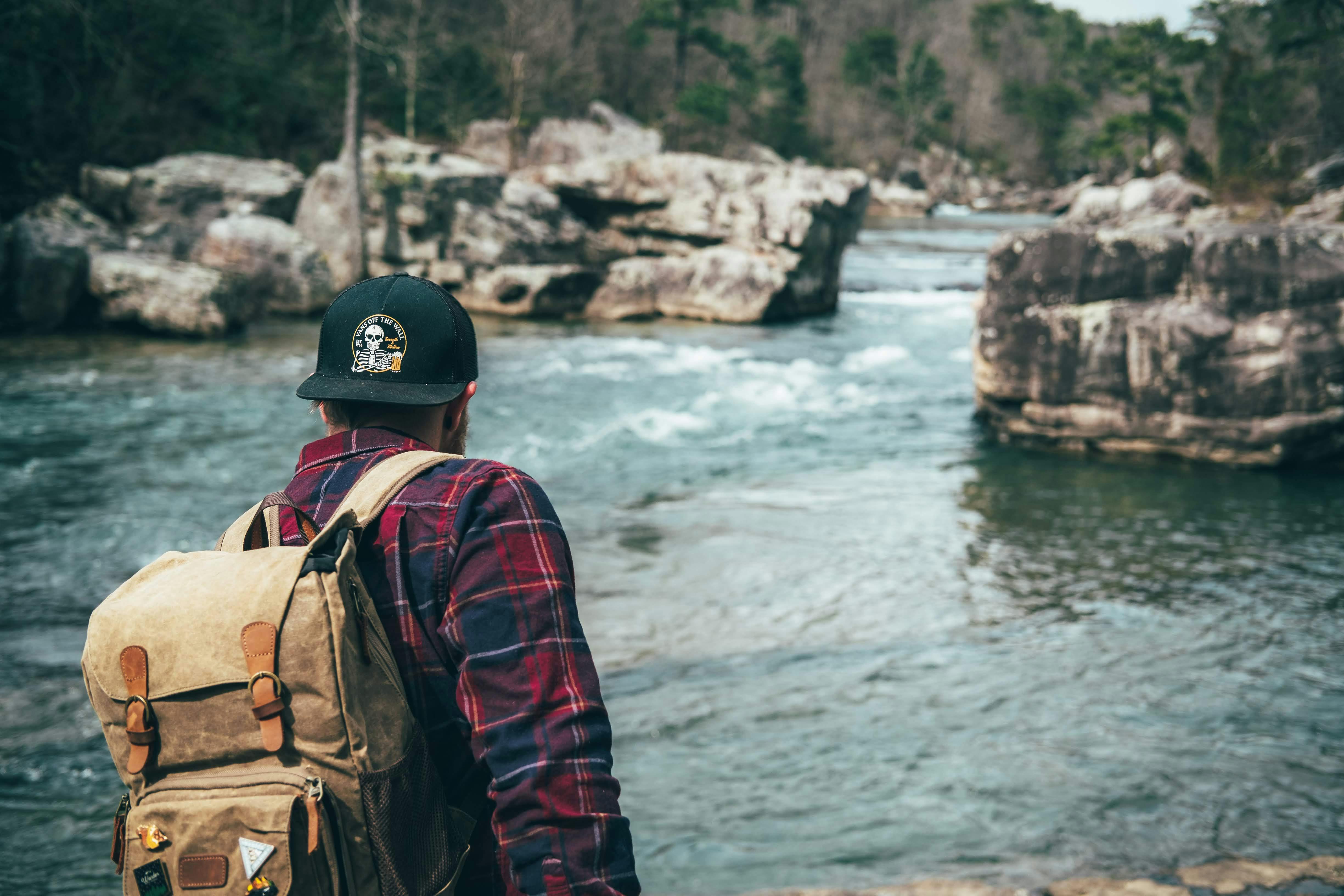 Backview of Man standing beside a River · Free Stock Photo