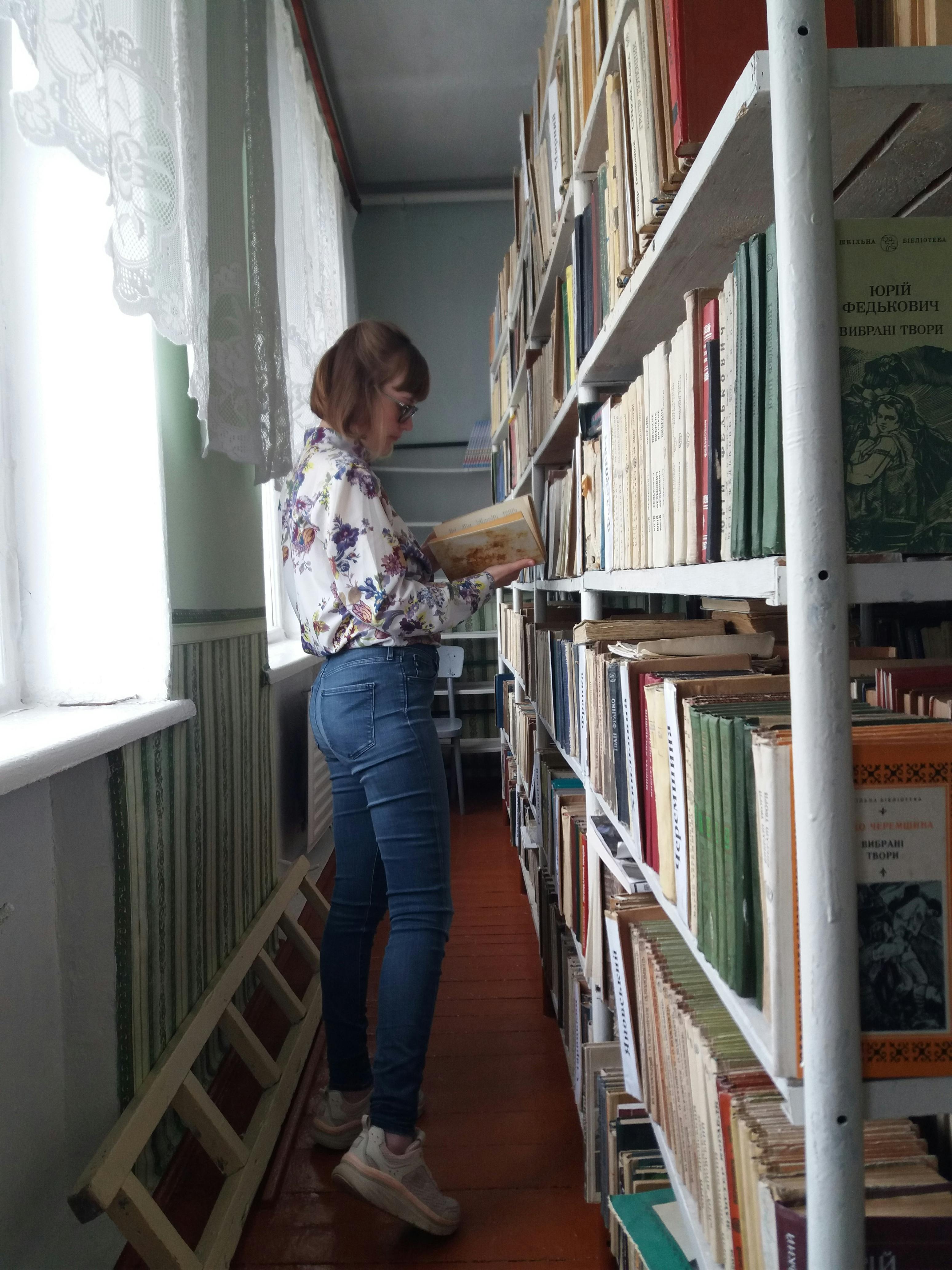 A Woman Inside a Library · Free Stock Photo