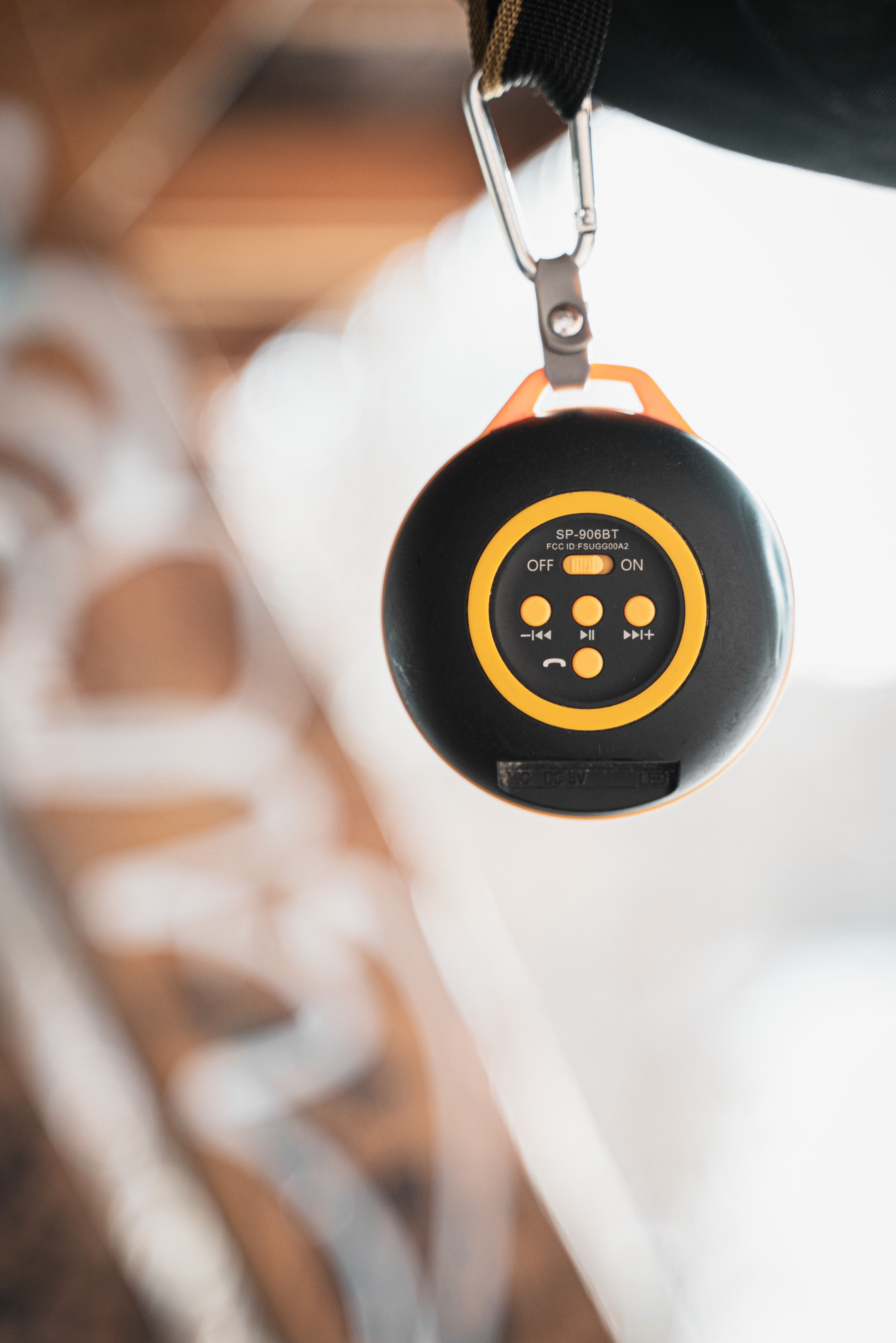 A Round Wireless Mini Electronic Gadget Close-up Shot · Free Stock Photo