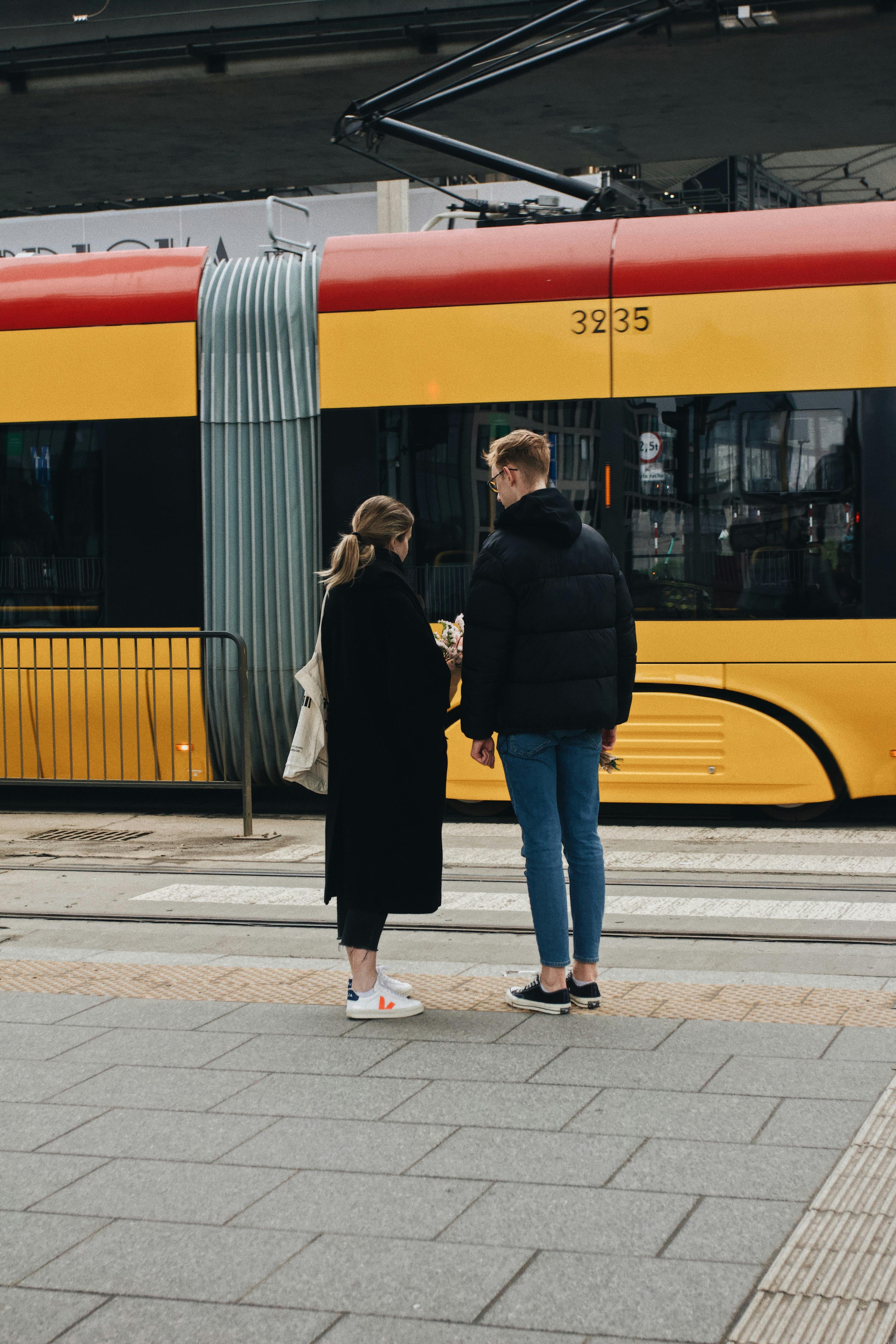 Person Standing on Train Platform · Free Stock Photo