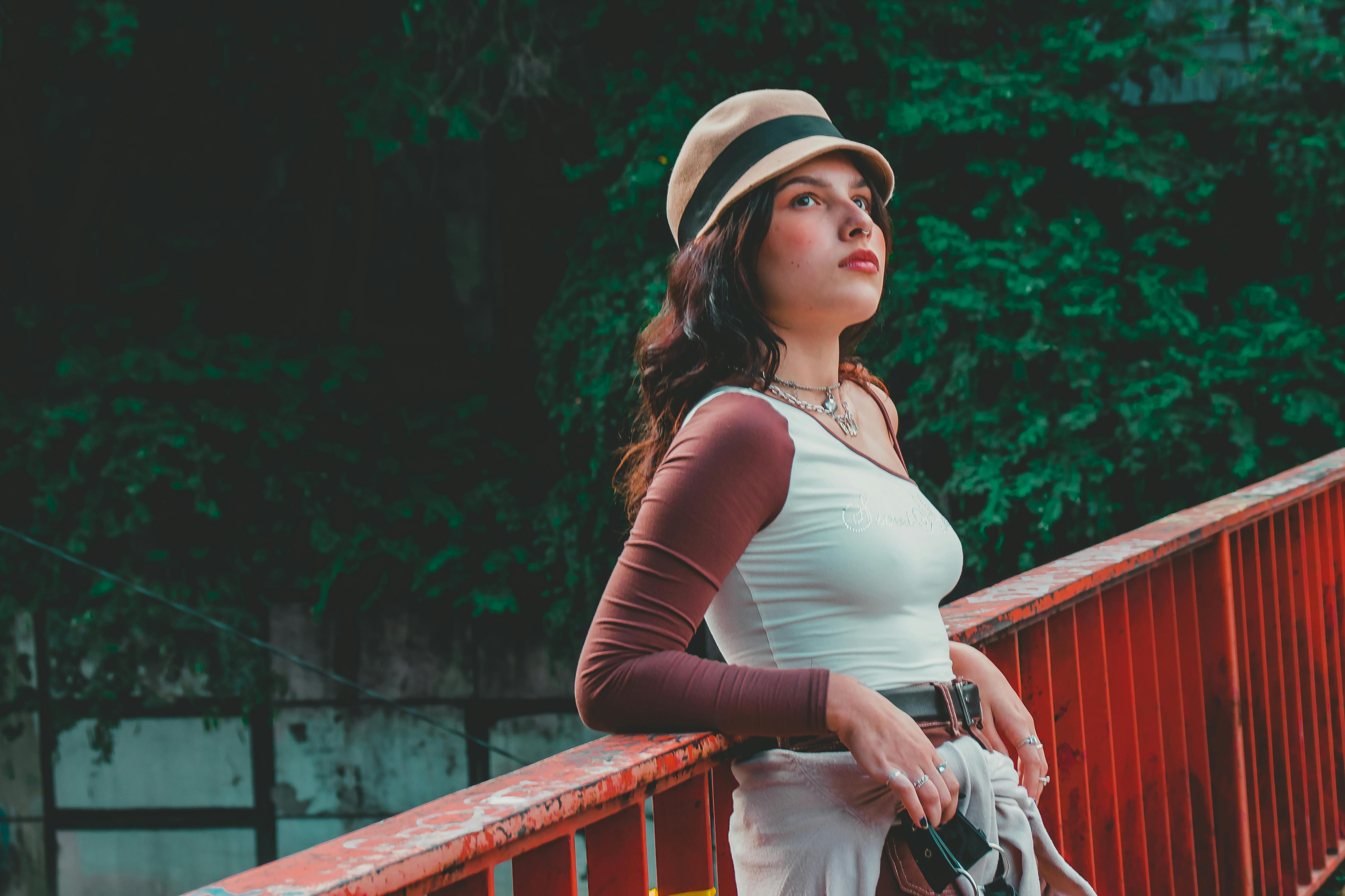 Portrait of Brunette Woman Leaning on Railing · Free Stock Photo