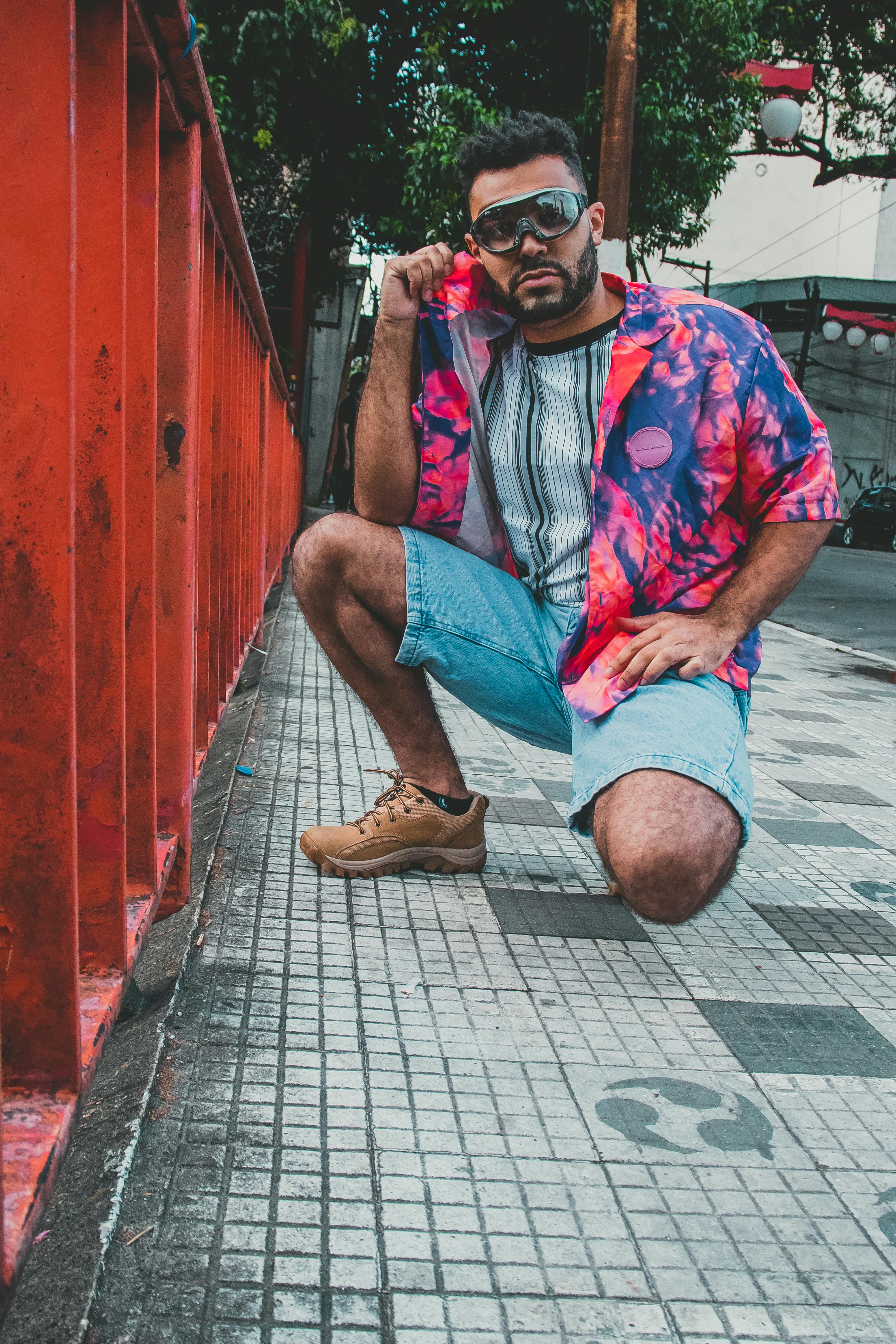 A Man Sitting on the Street · Free Stock Photo