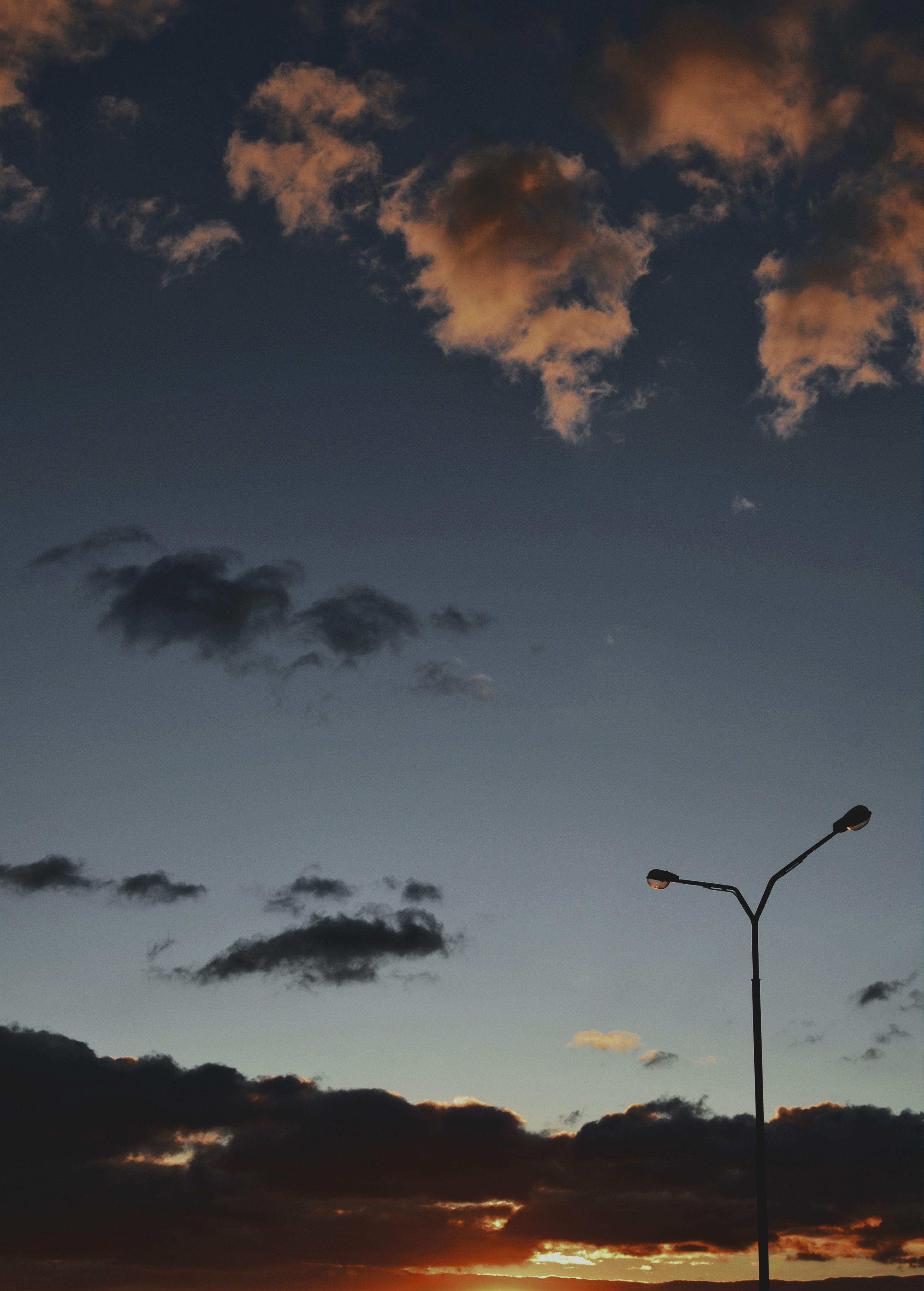 Silhouette of Street Lamp Under Gloomy Sky during Sunset · Free Stock Photo