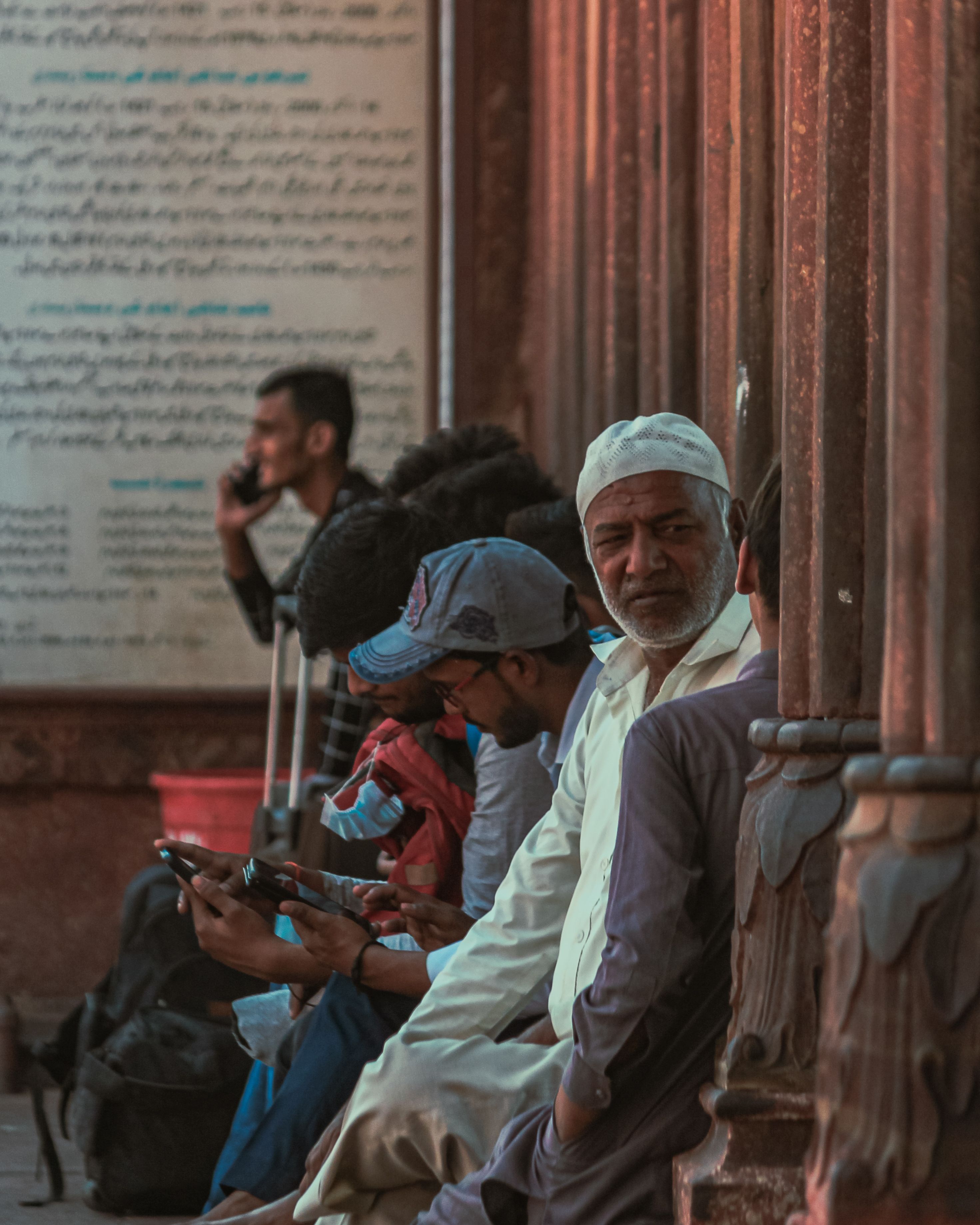 Men Sitting on the Street · Free Stock Photo