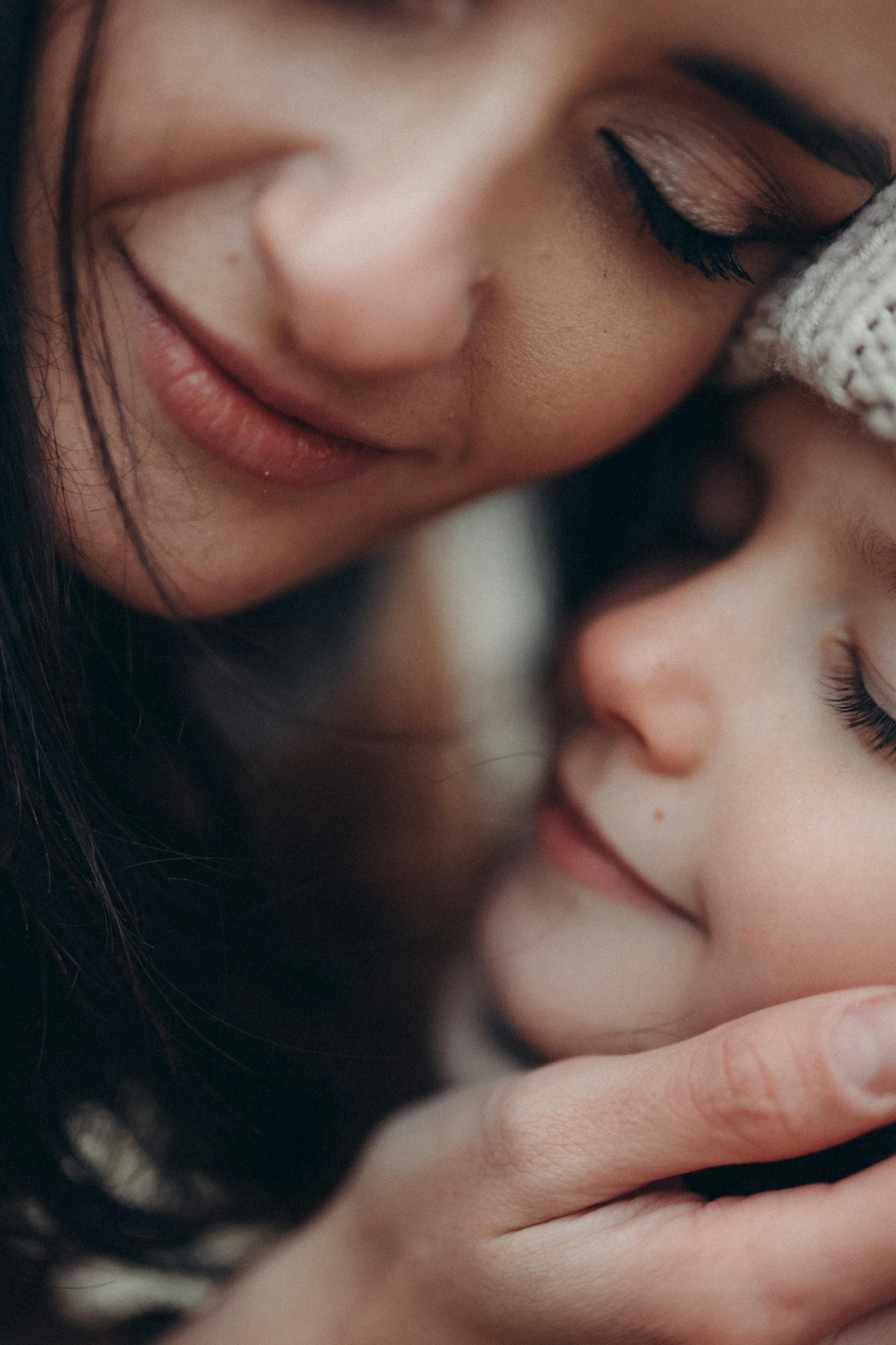 Close-up Photo of an Affectionate Mother on her Child · Free Stock Photo