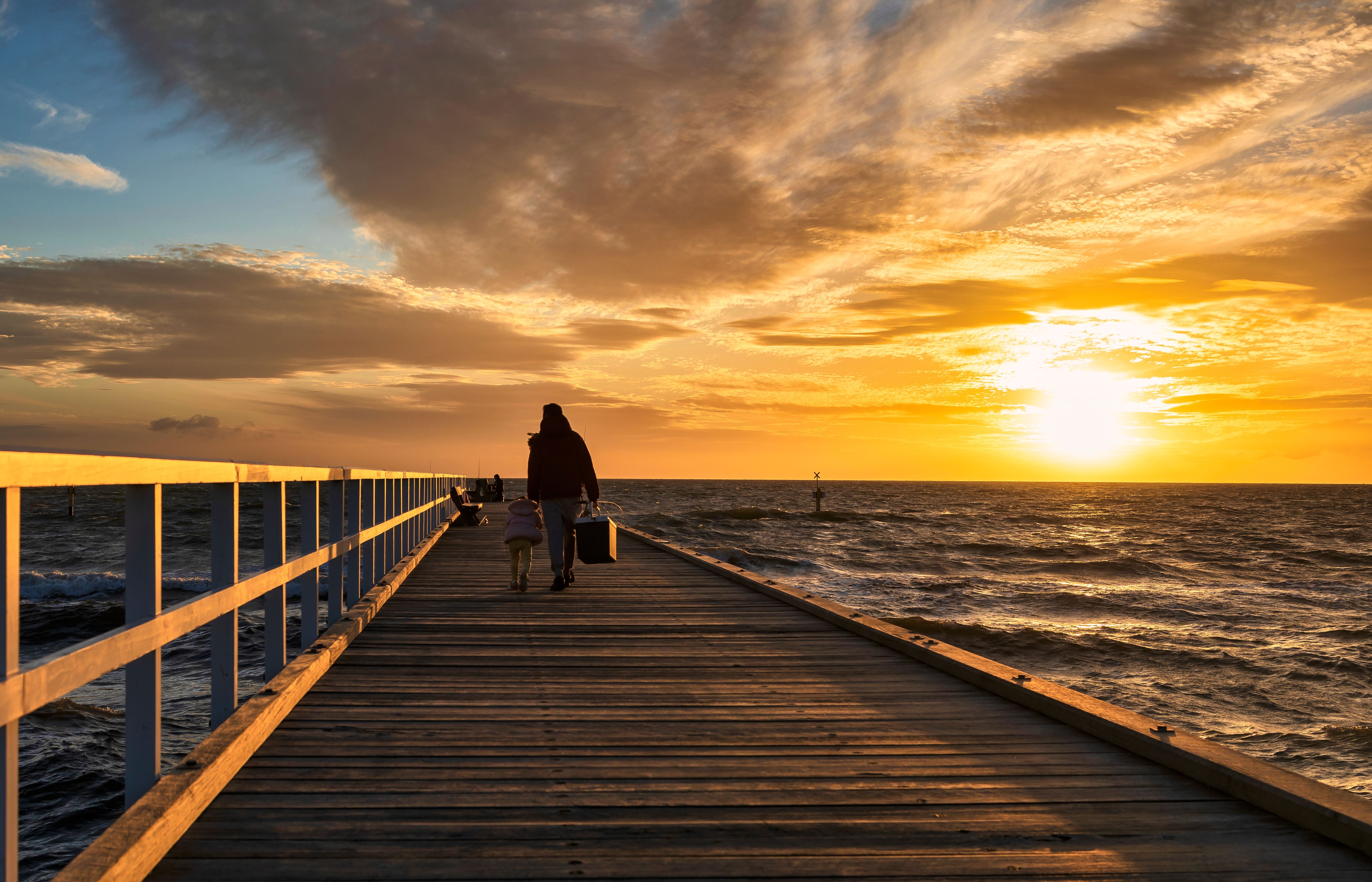 Photo of People on Wooden Dock During Sunset · Free Stock Photo
