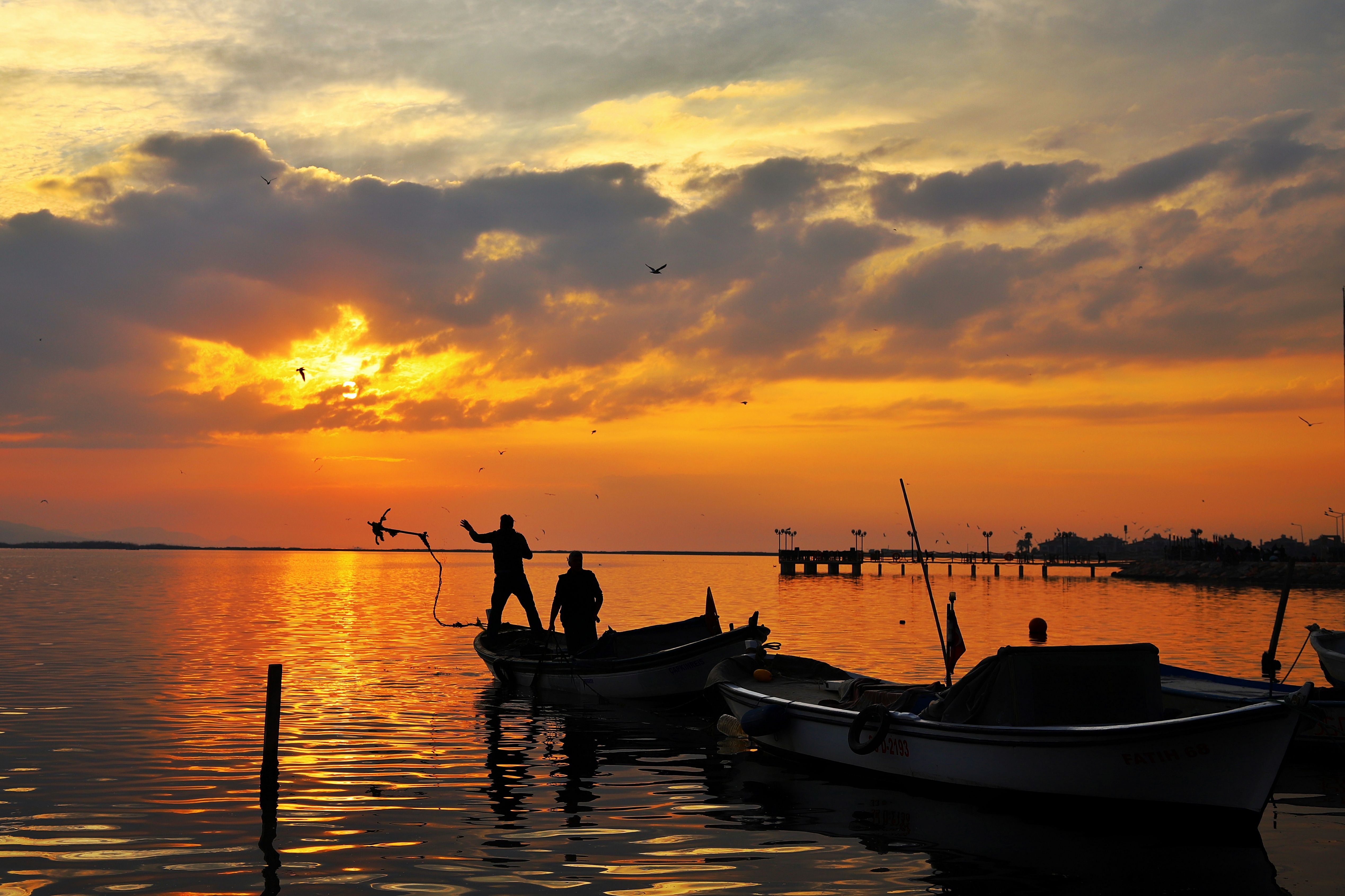 Silhouette of 2 Person Riding on Boat during Sunset · Free Stock Photo