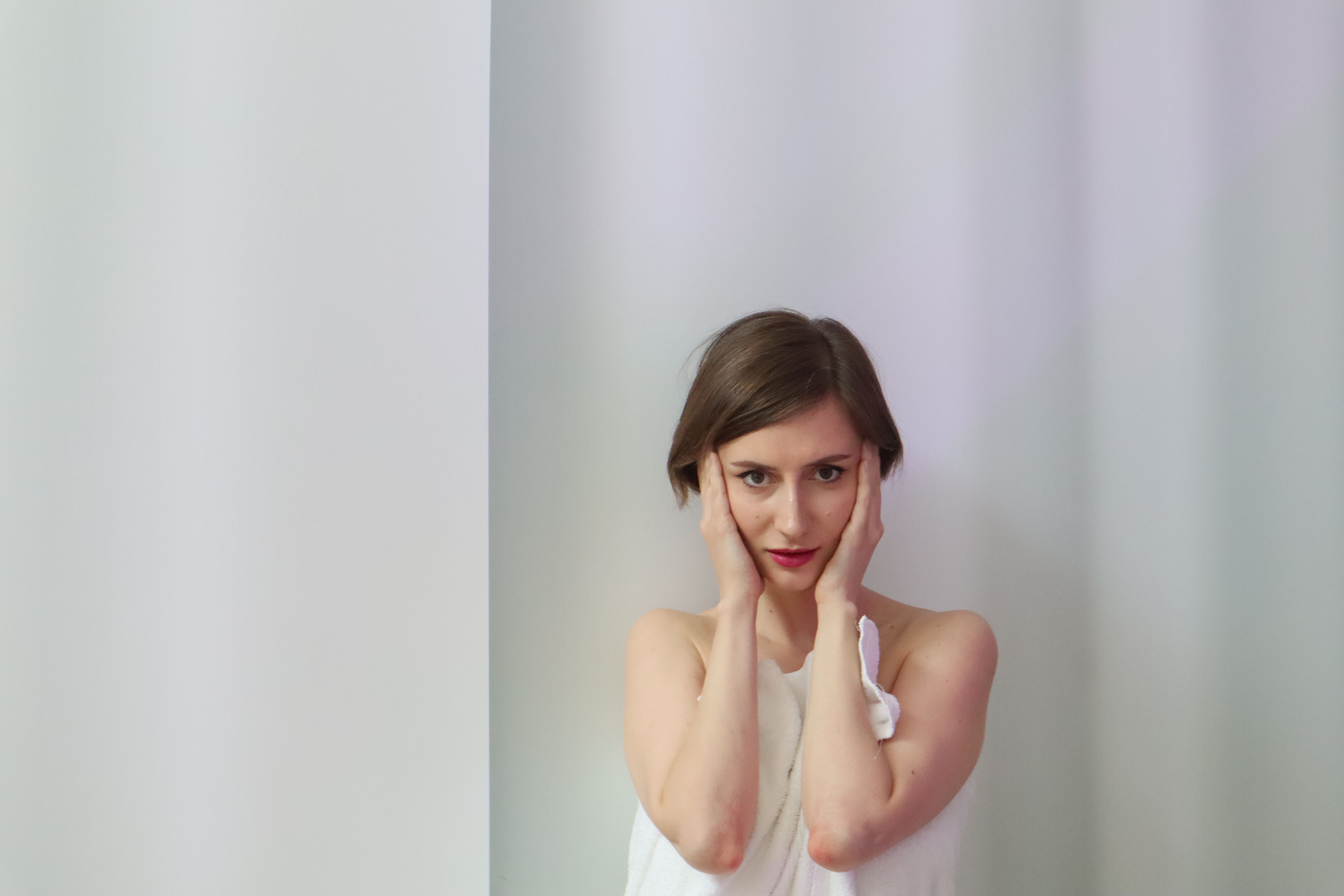 Woman Thinking with Hand on Cheek · Free Stock Photo