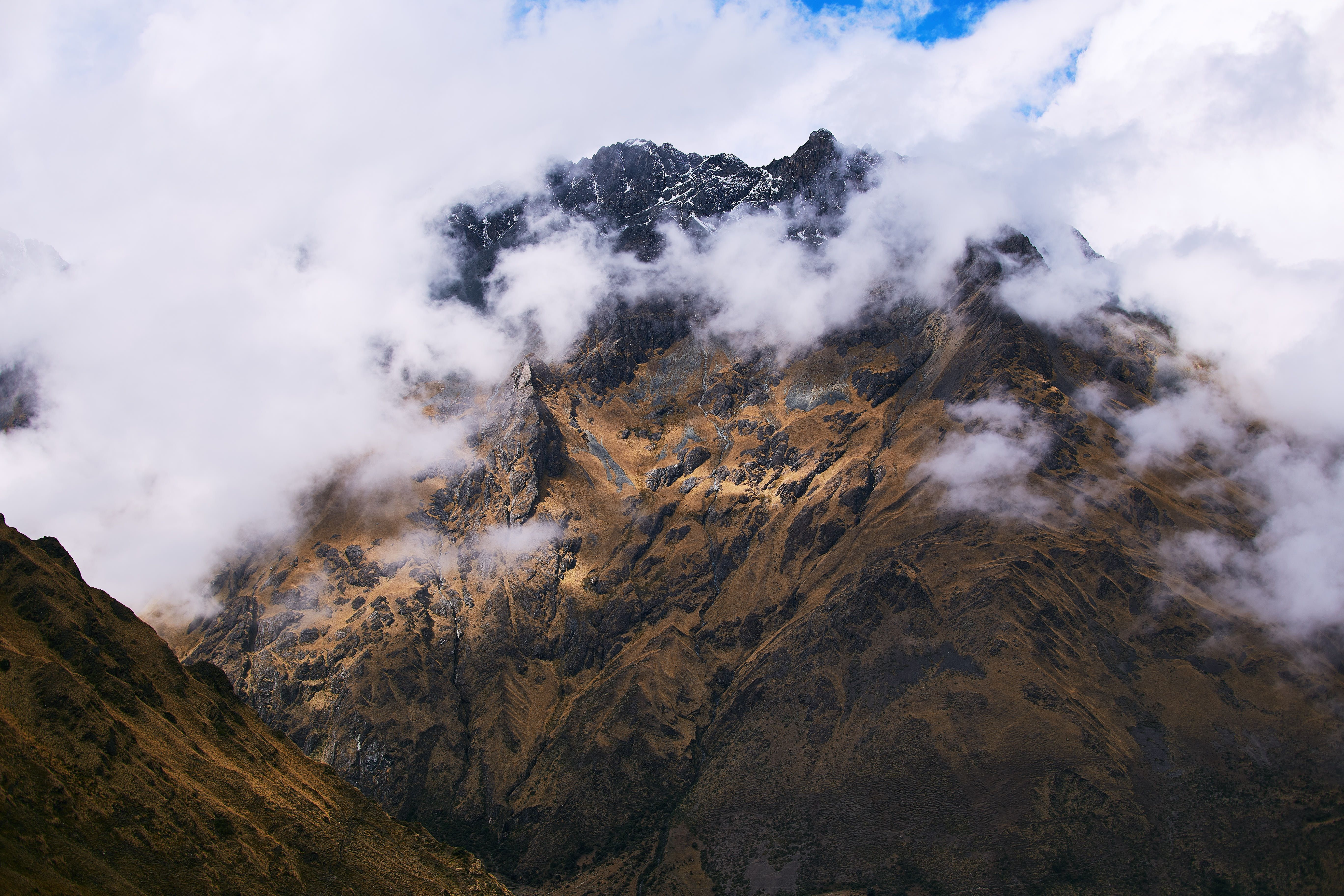 Aerial View of Clouds over Valley in Mountains · Free Stock Photo