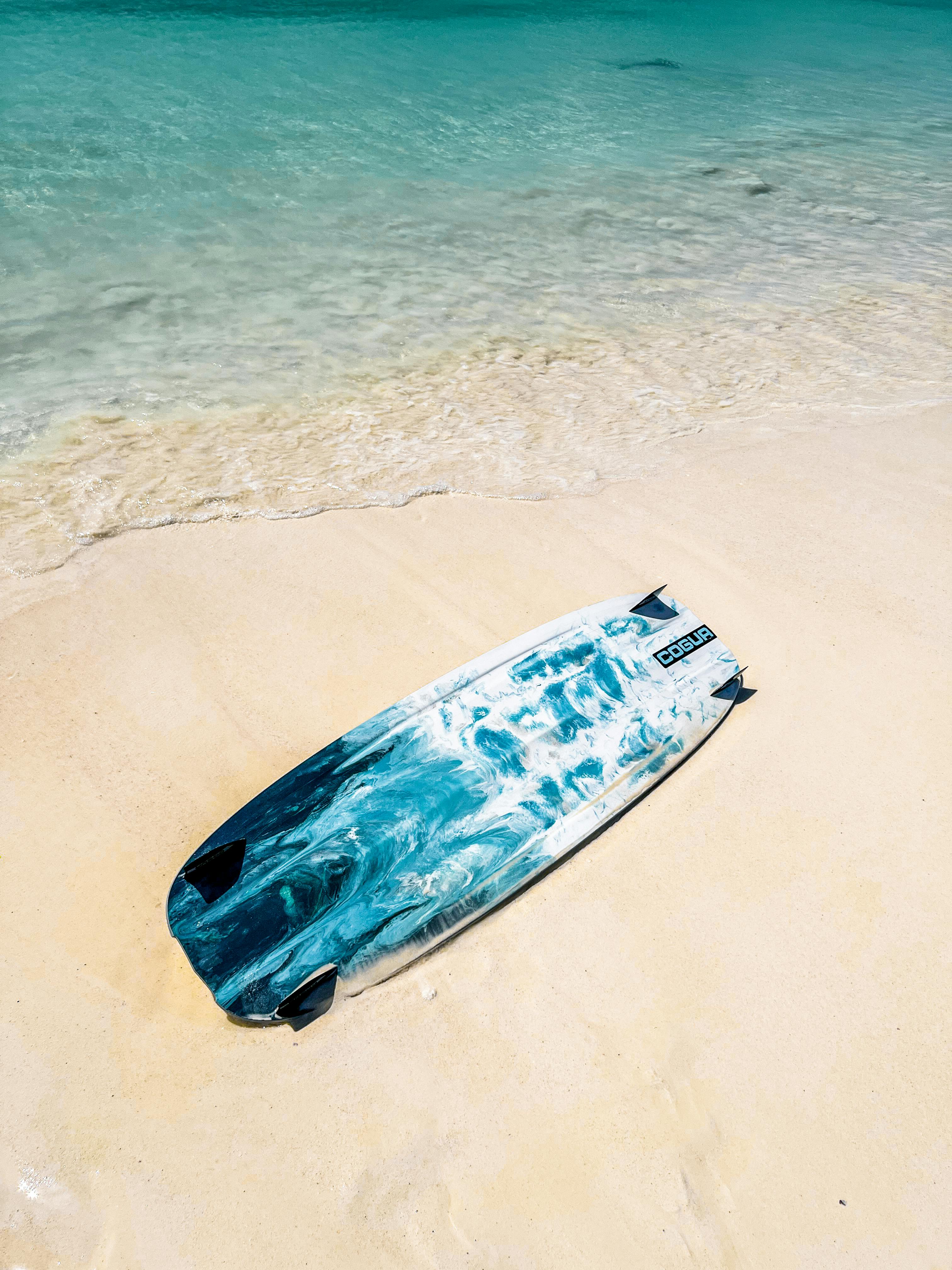 Boat with Red Flaglets on the Sea Shore · Free Stock Photo