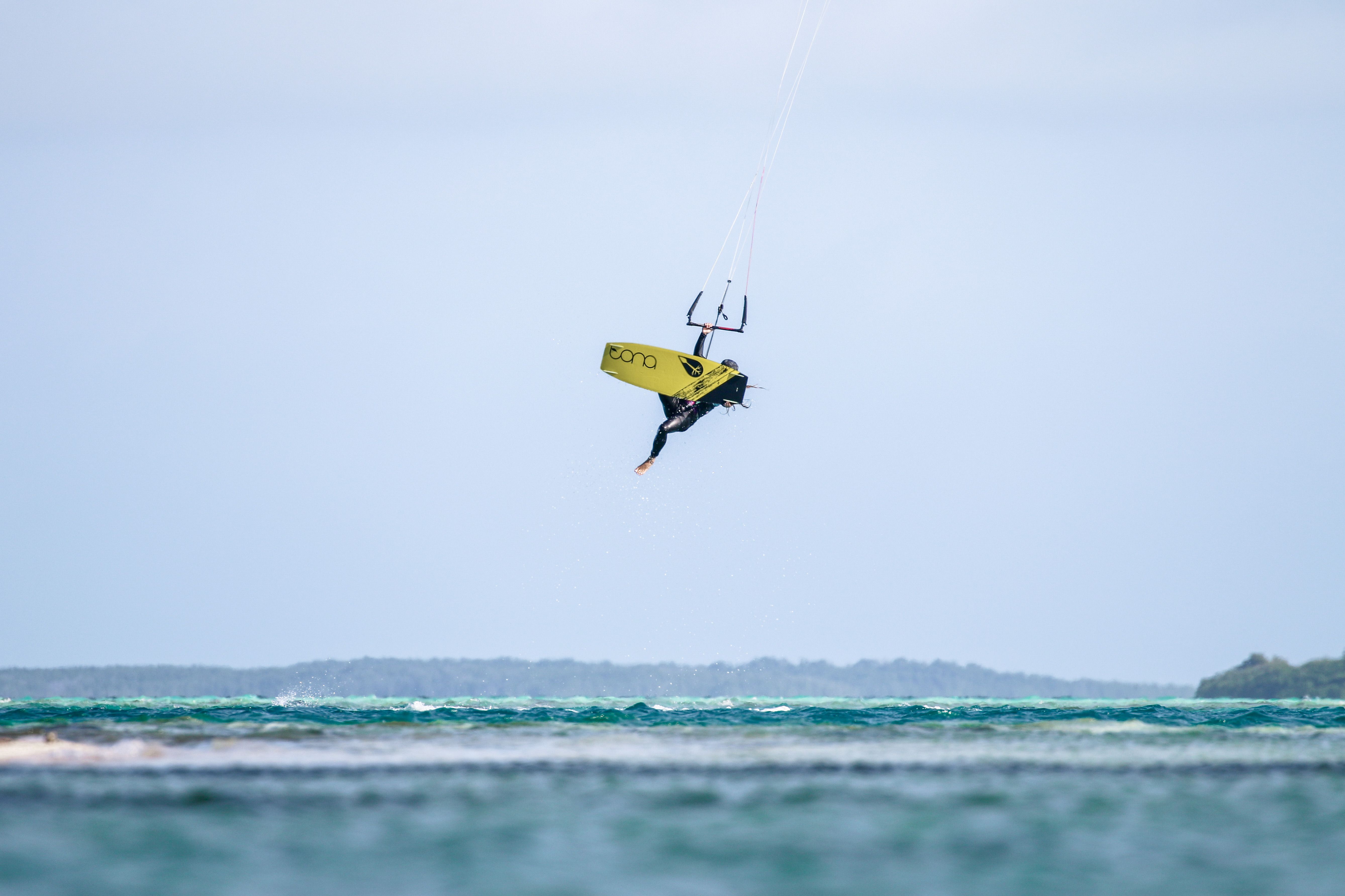 A Person Kiteboarding on the Beach · Free Stock Photo
