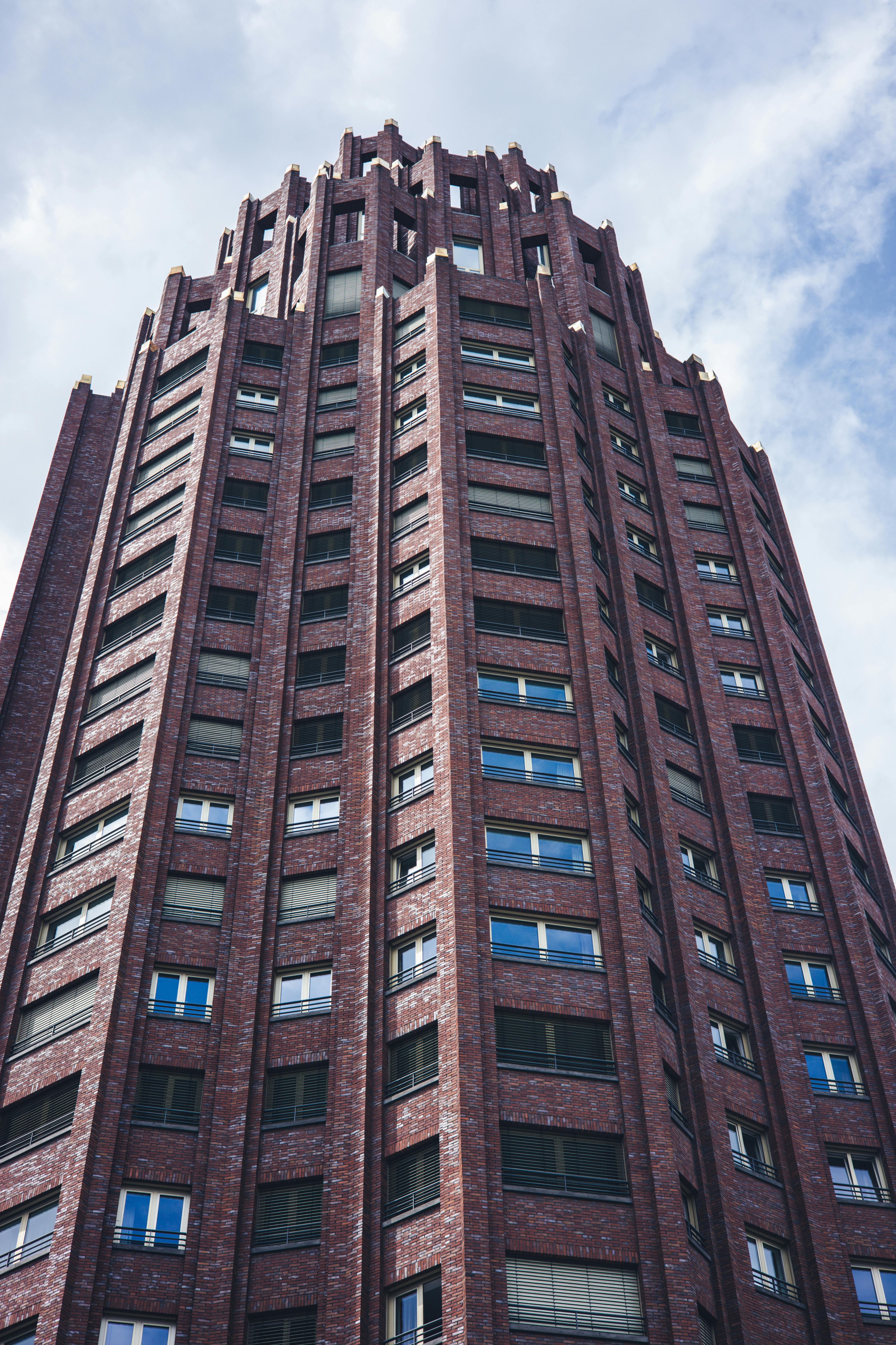 High Rise Brick Building with Arched Windows · Free Stock Photo
