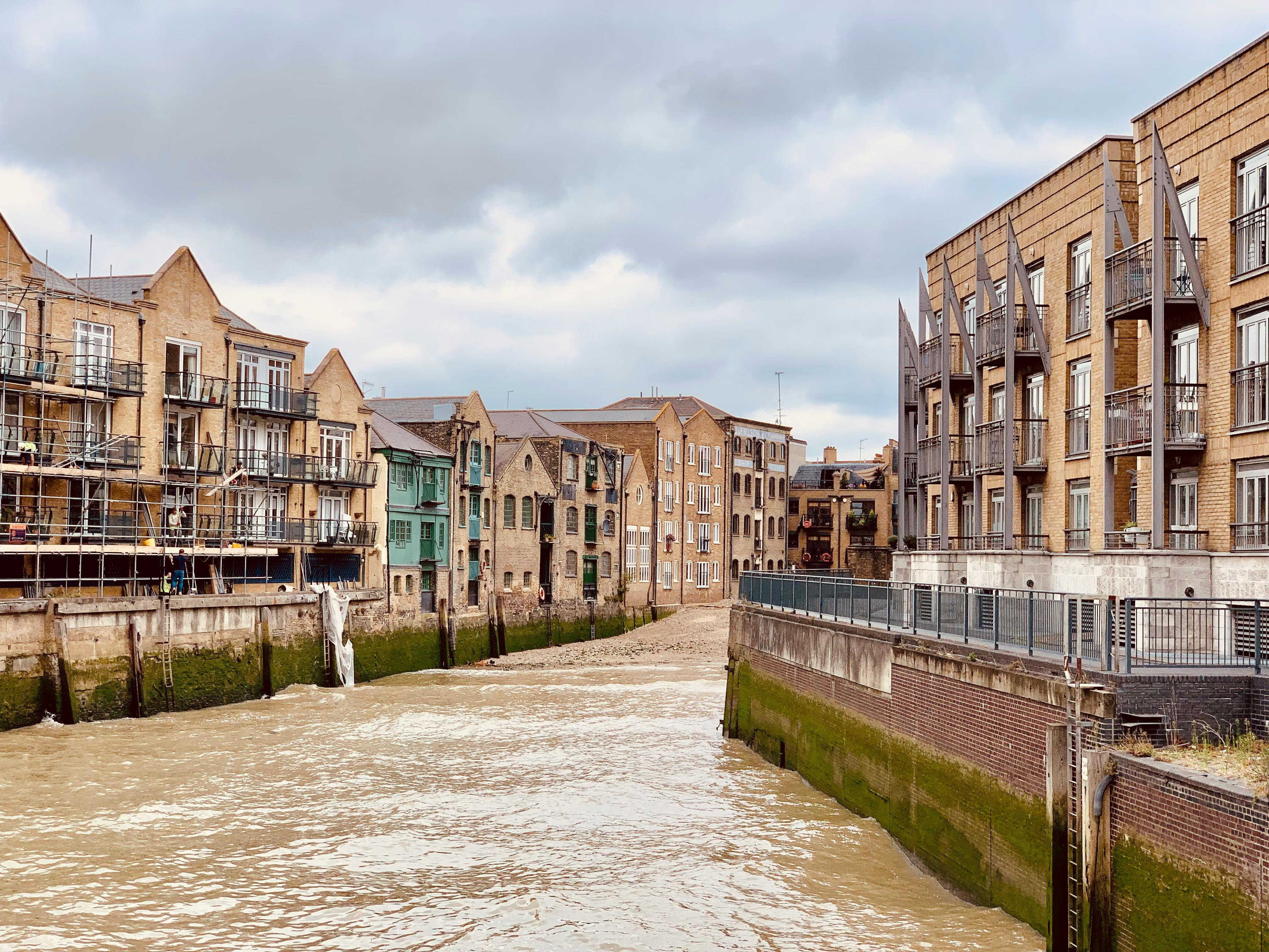 A River Between Apartment Buildings · Free Stock Photo