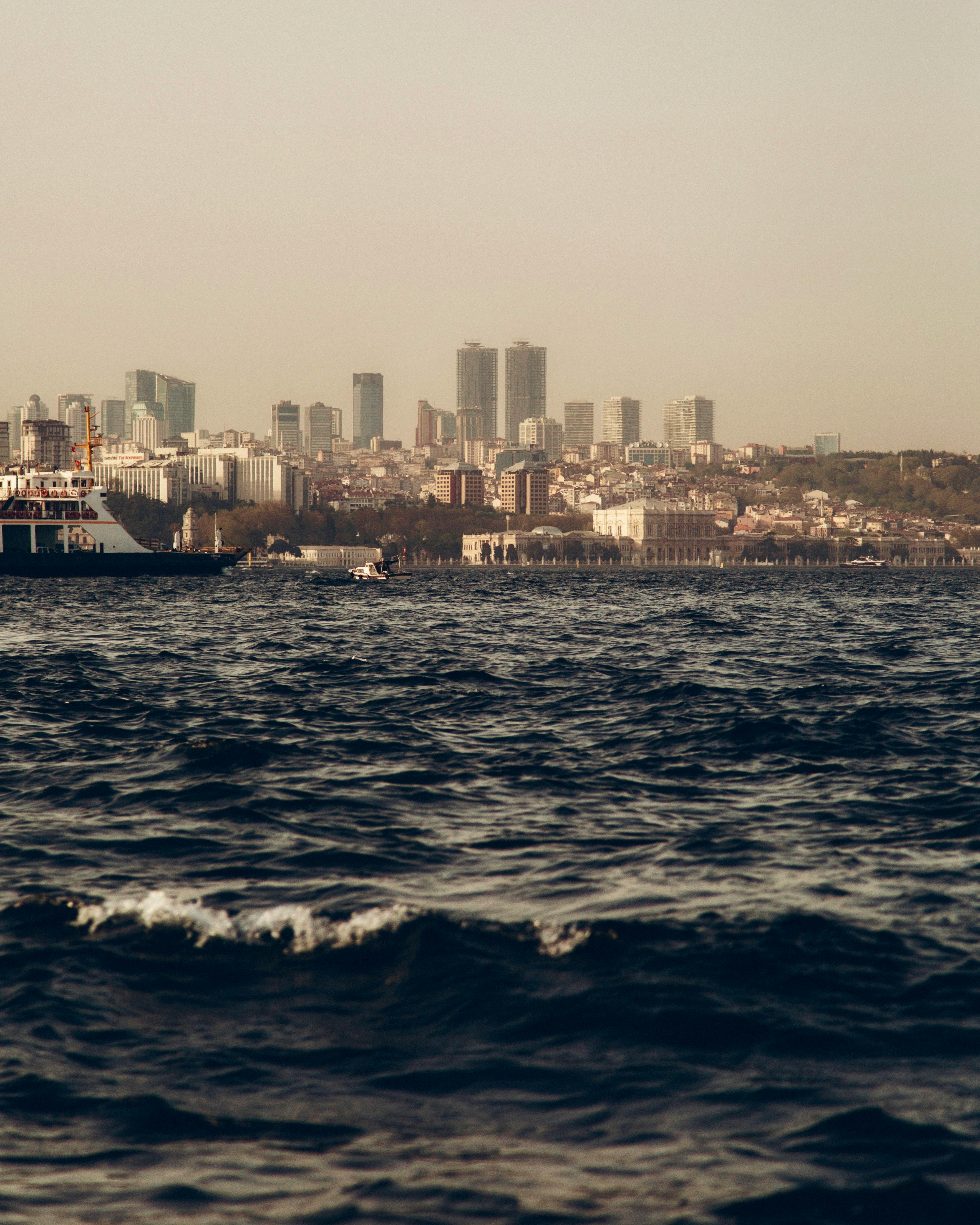 City Skyline Across Body of Water · Free Stock Photo