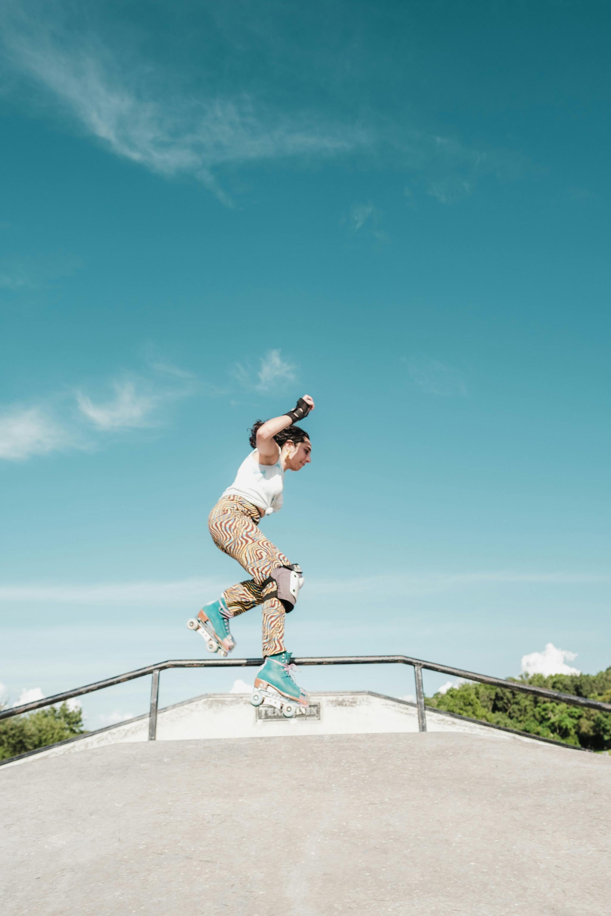Woman Doing Tricks on Roller Skates on Handrail · Free Stock Photo