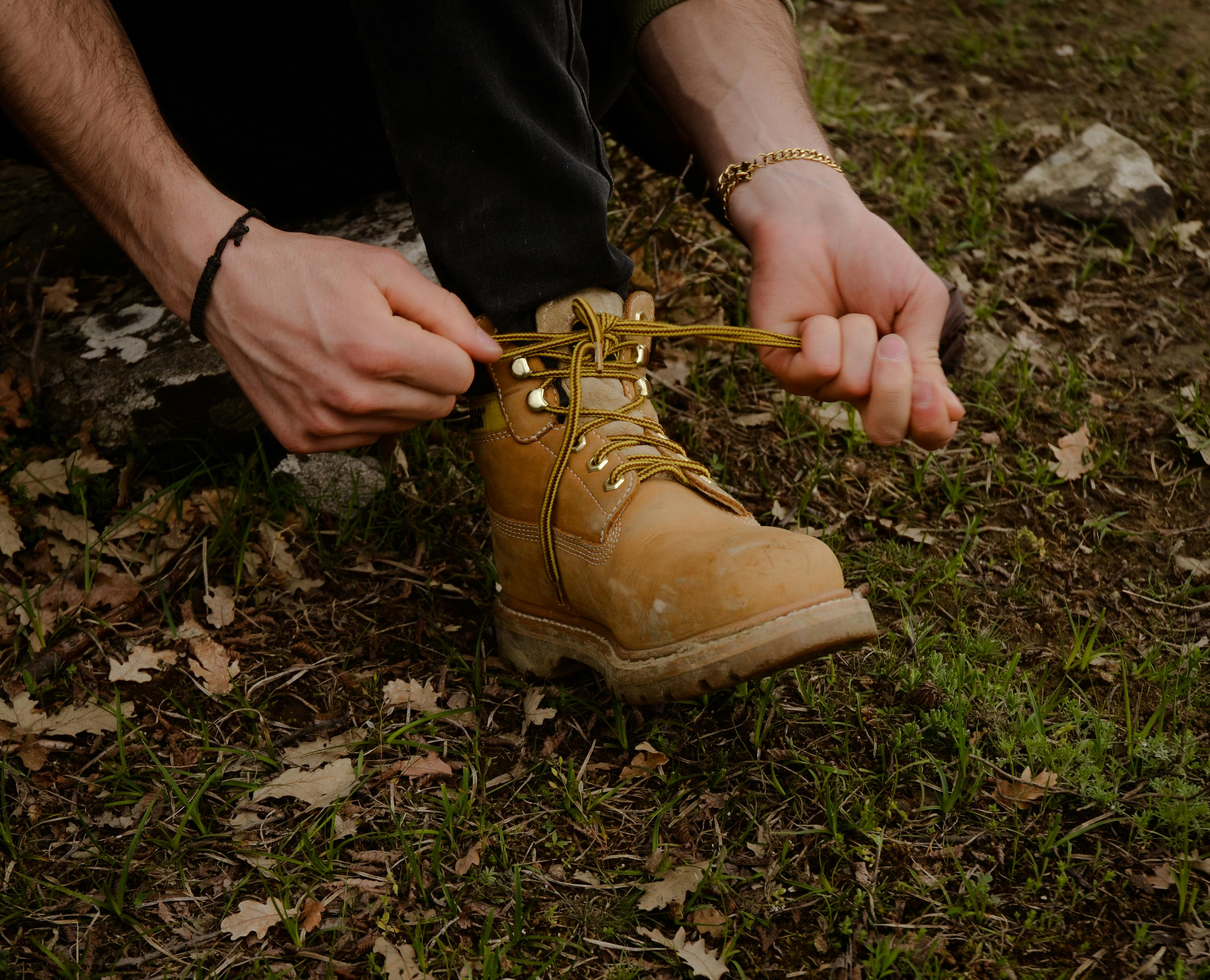 Person Wearing Black Leather Boots · Free Stock Photo