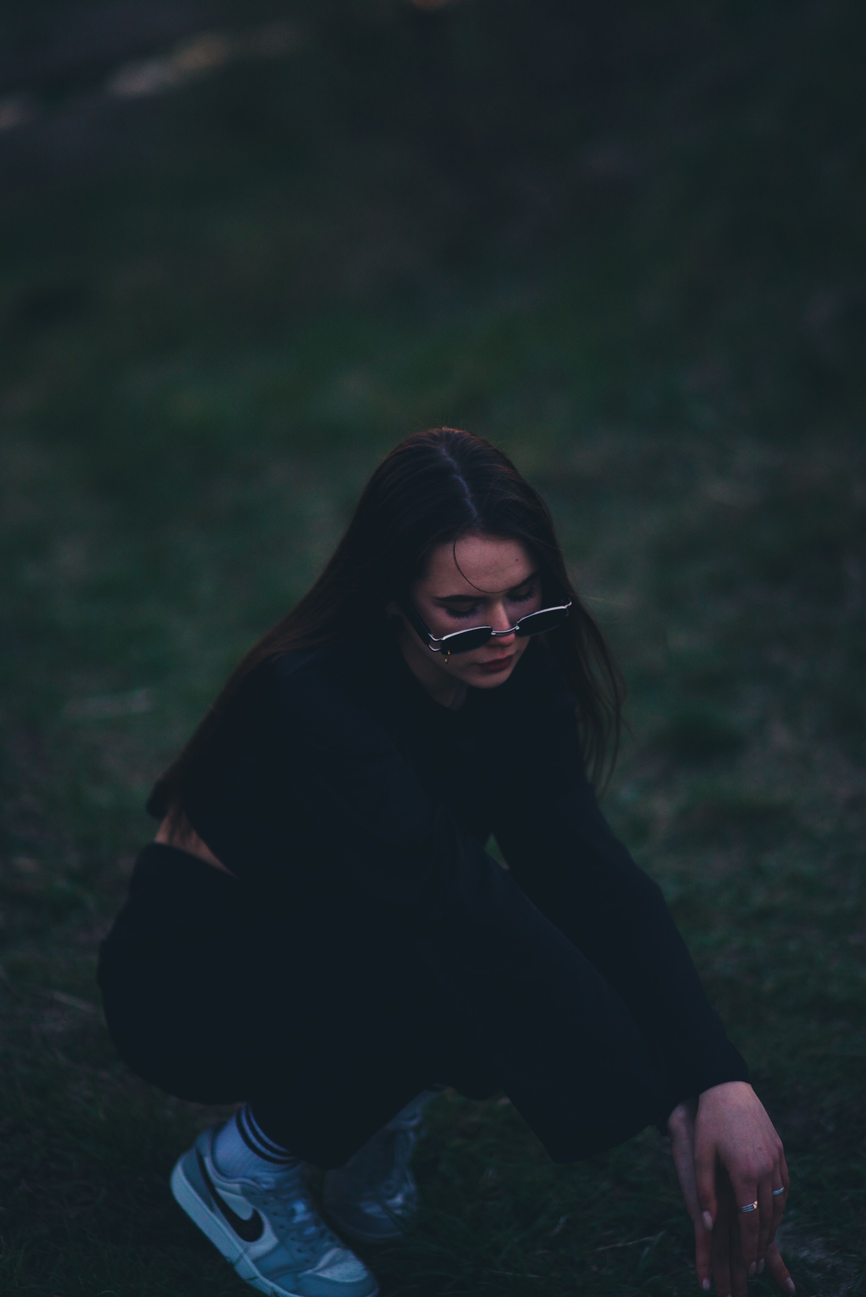 Woman Crouching in Painting Workshop · Free Stock Photo